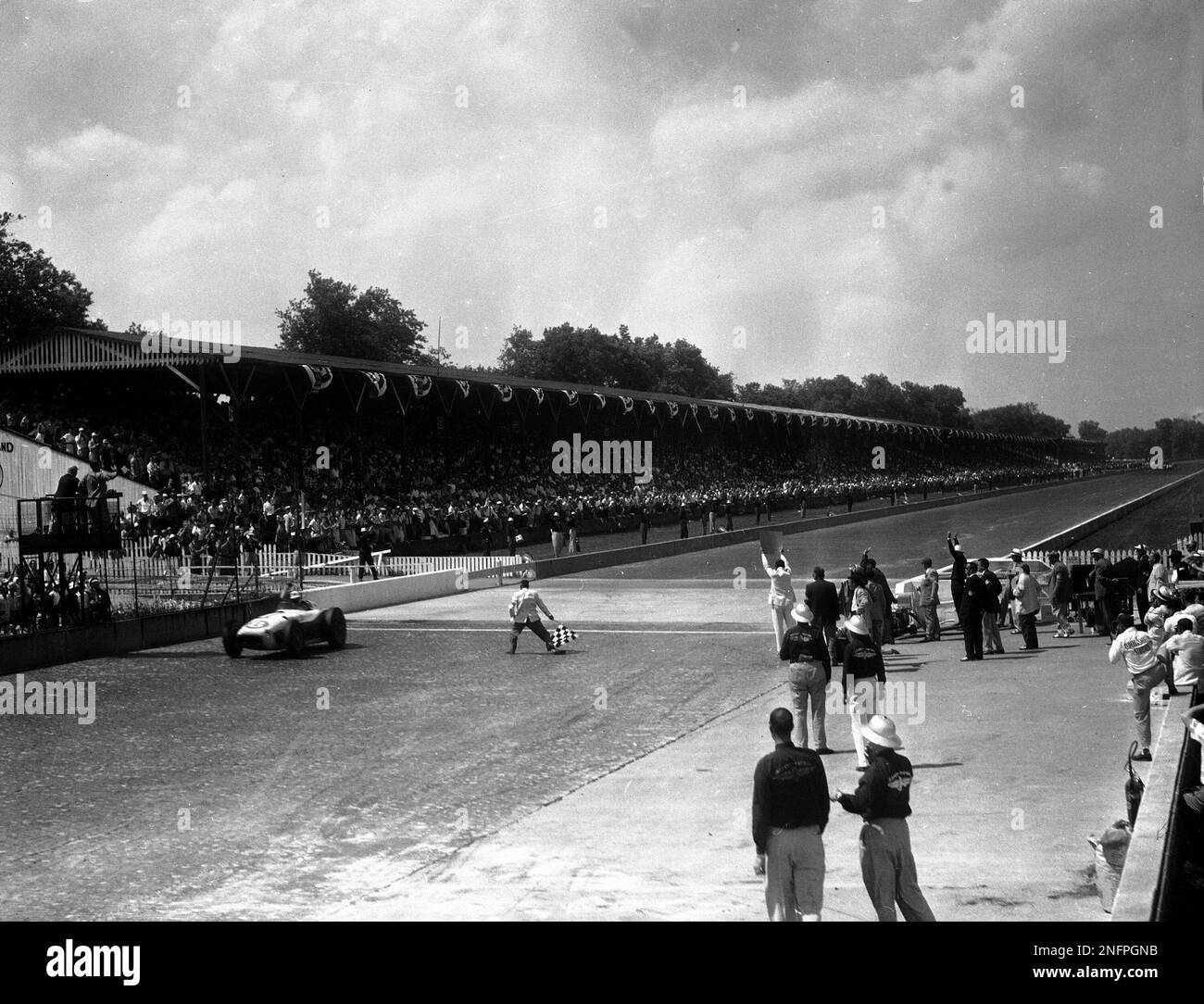 Pat Flaherty is the first across the finish line to win the 500-mile ...