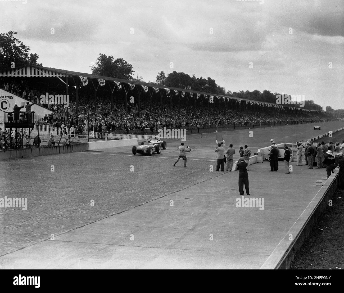 Bob Sweikert, in a Zink Special, left, followed closely by another car ...