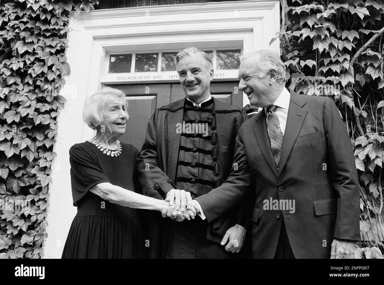 Harvard President Derek C. Bok, center, shakes hands with honorary ...