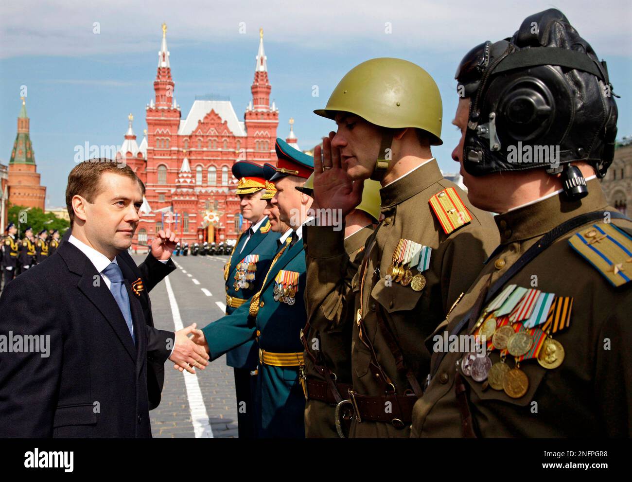 Russian President Dmitry Medvedev, left, looks at the militaries ...
