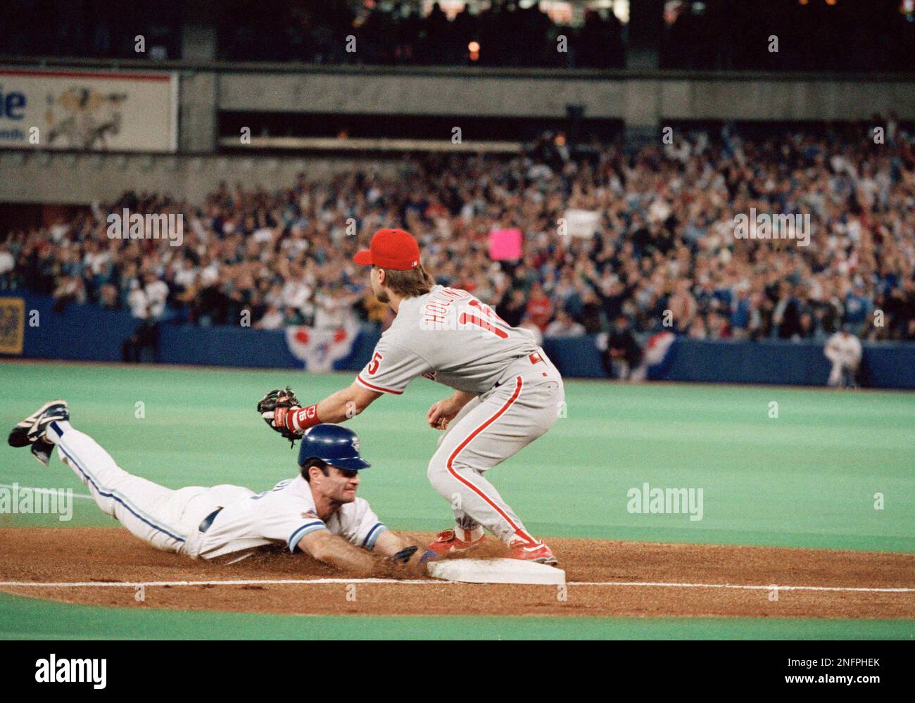 Toronto Blue Jays Paul Molitor slides into third base on a triple as ...