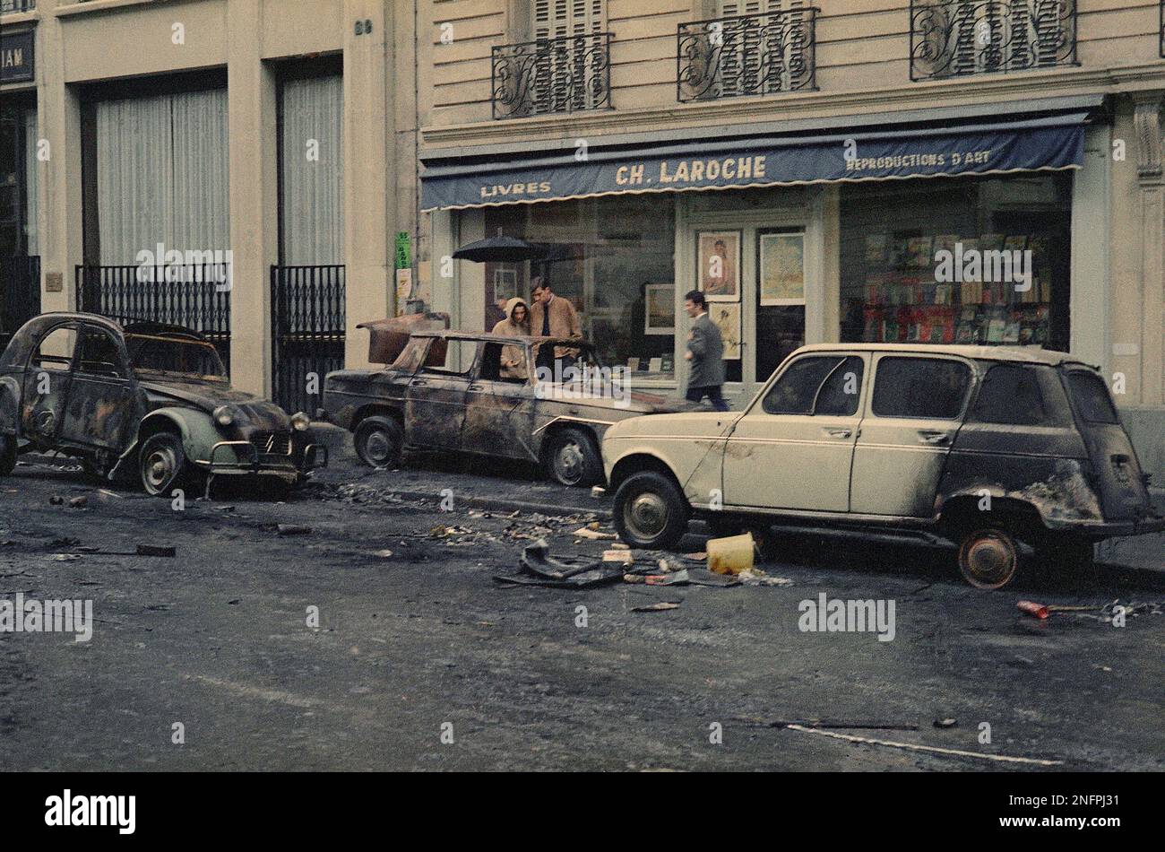 The hulks of burned out vehicles are strewn in the streets Paris' Latin ...