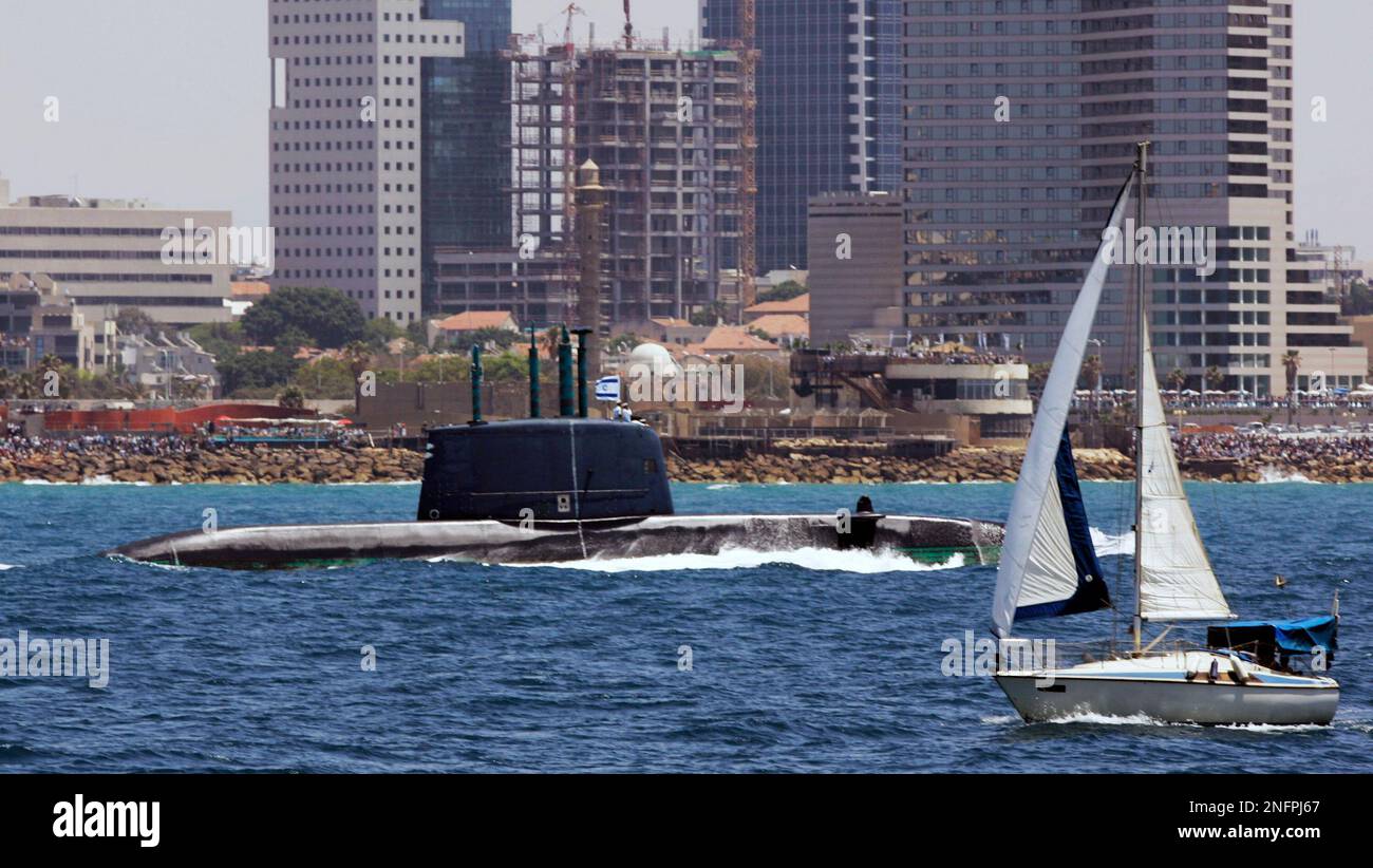 A dolphin class Israeli submarine sails past the coastline during an ...