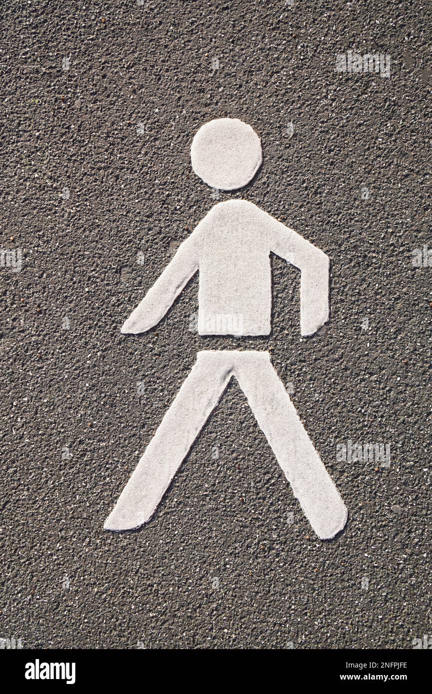 Pedestrian pictogram symbol road marking on asphalt Stock Photo - Alamy