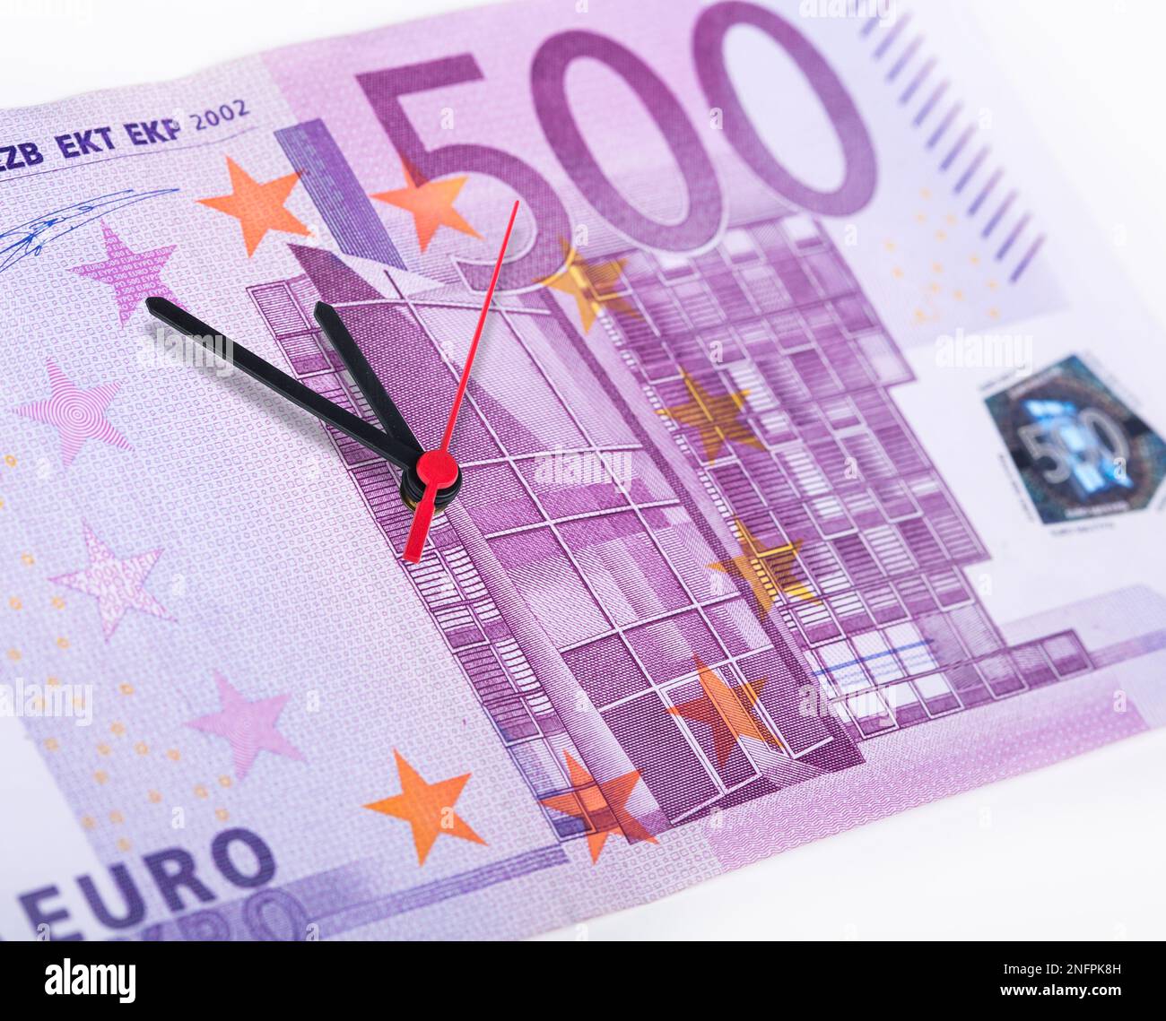 A 500 Euro banknote with Clockwise, Time is money concept Stock Photo ...
