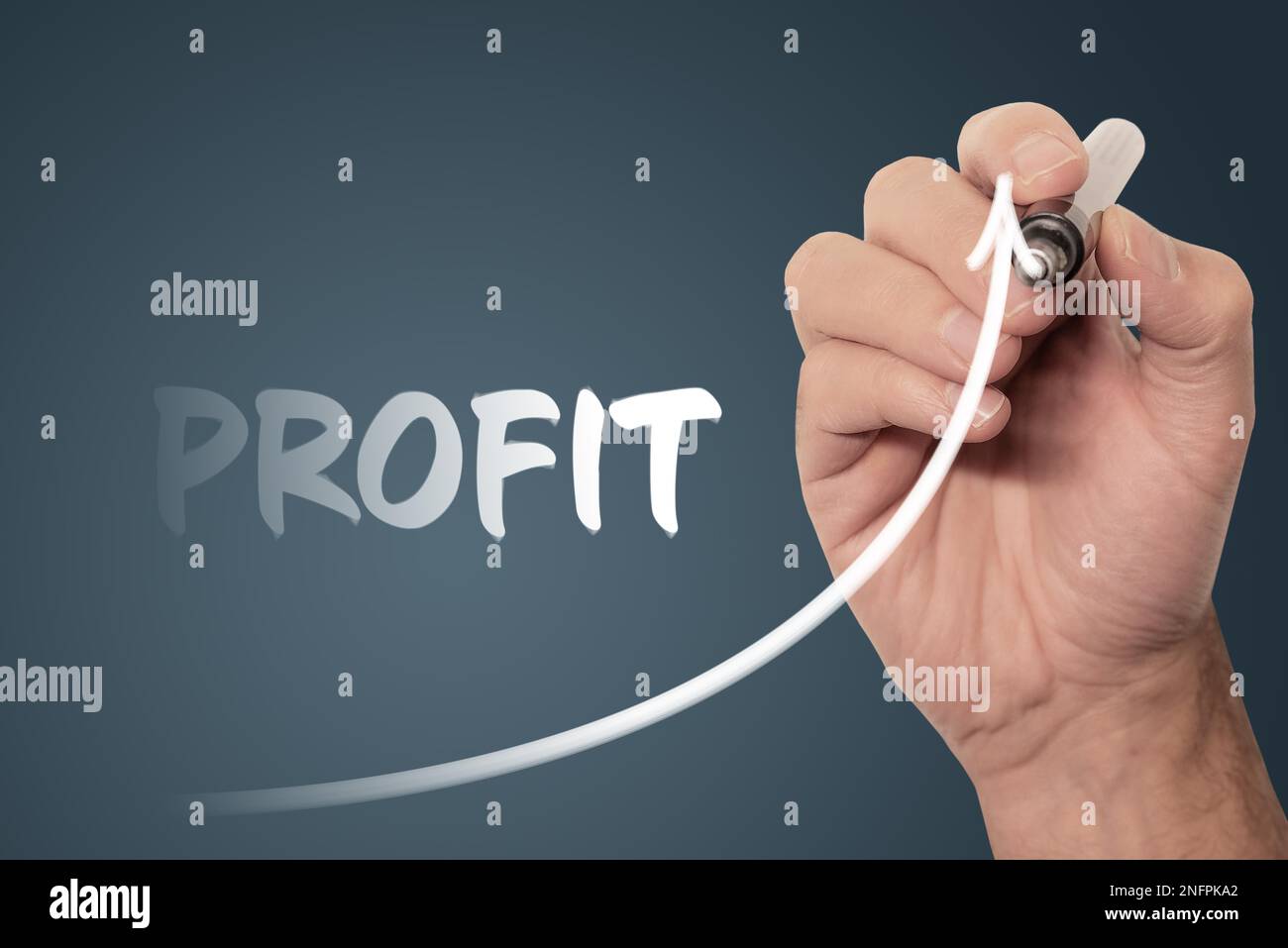 hand holding whiteboard marker pen drawing increasing profit graph on ...