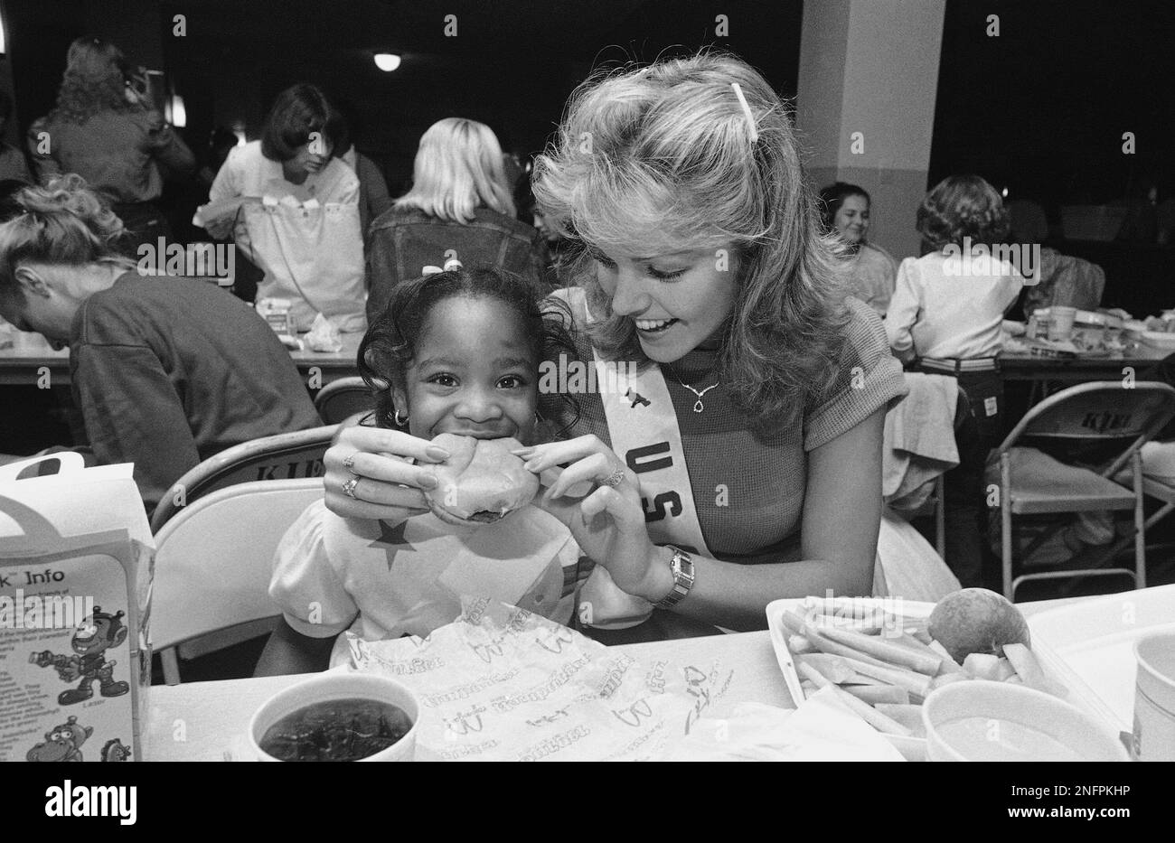 Miss USA of 1983 Julie Hayek gives a little help to "Little Sister ...