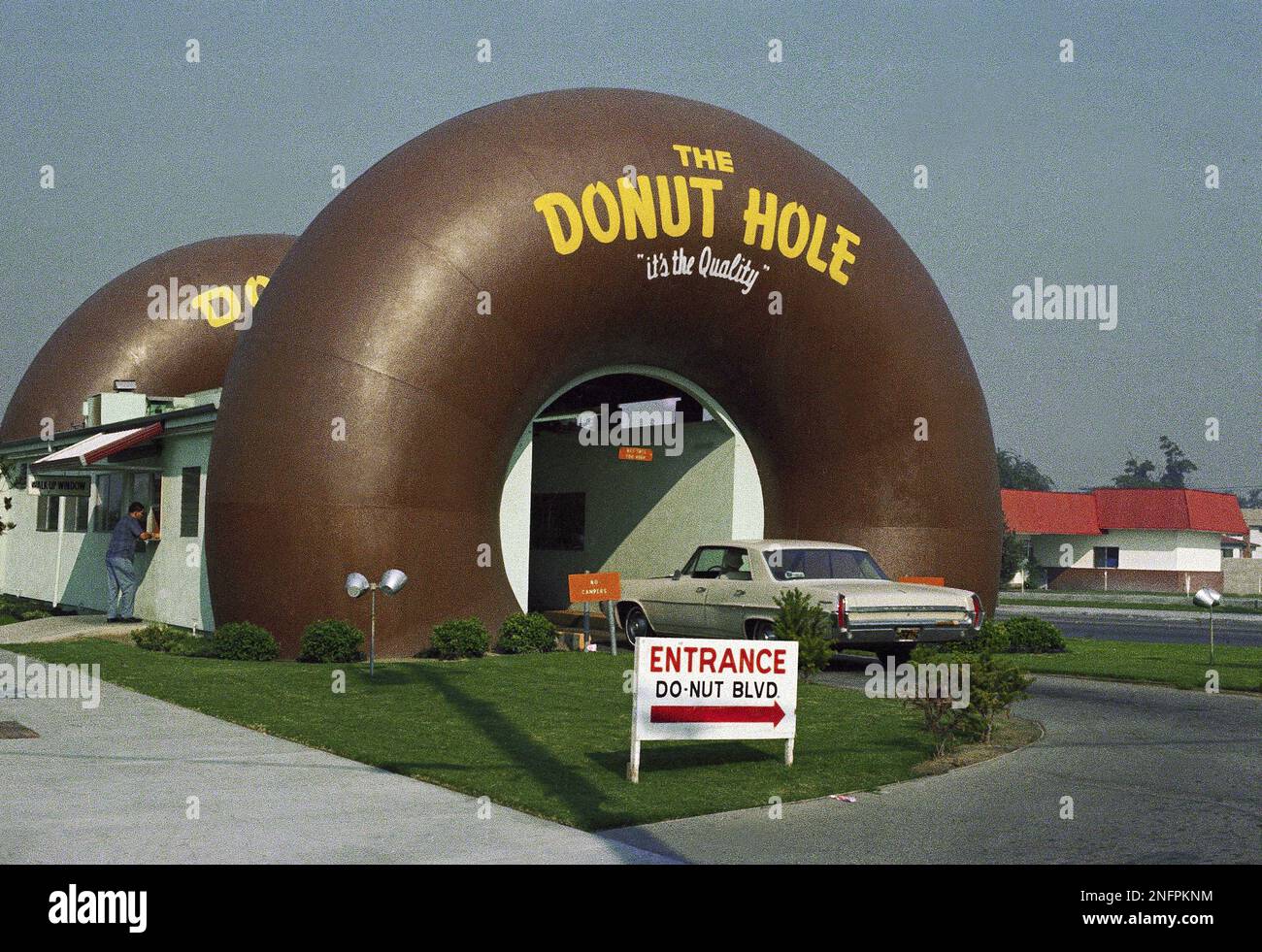 A drive-through coffee and donut shop in an eye-catching building, the ...