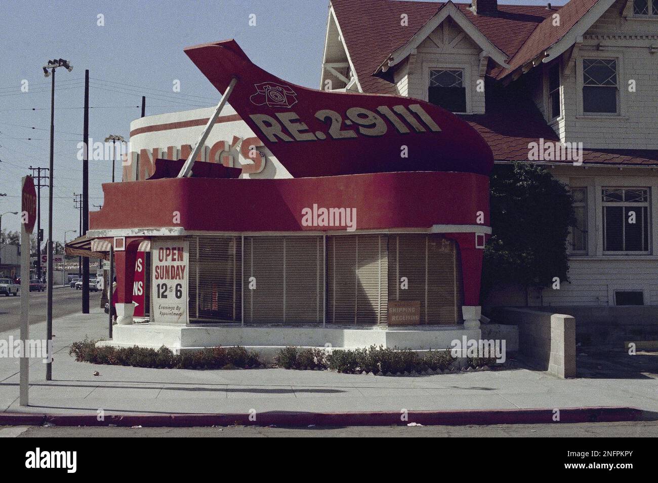 A piano and organ store in an eye-catching building shaped like a piano ...
