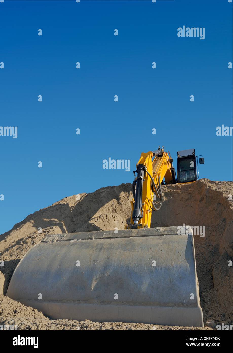 Excavator in action, wide angle shot taken from below. A4, A3, A2 and ...