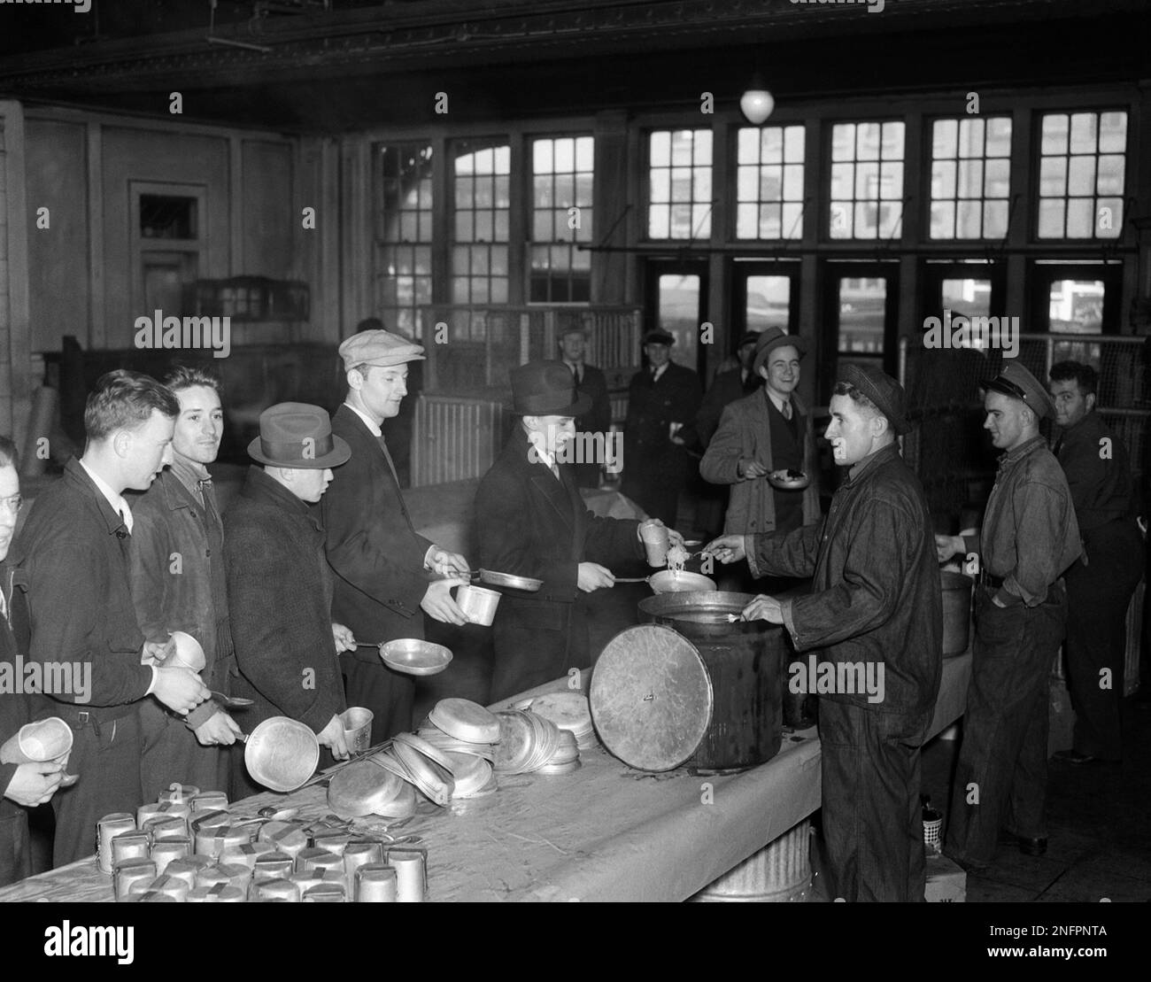 Recruits for the Civilian Conservation Corps are shown passing through ...