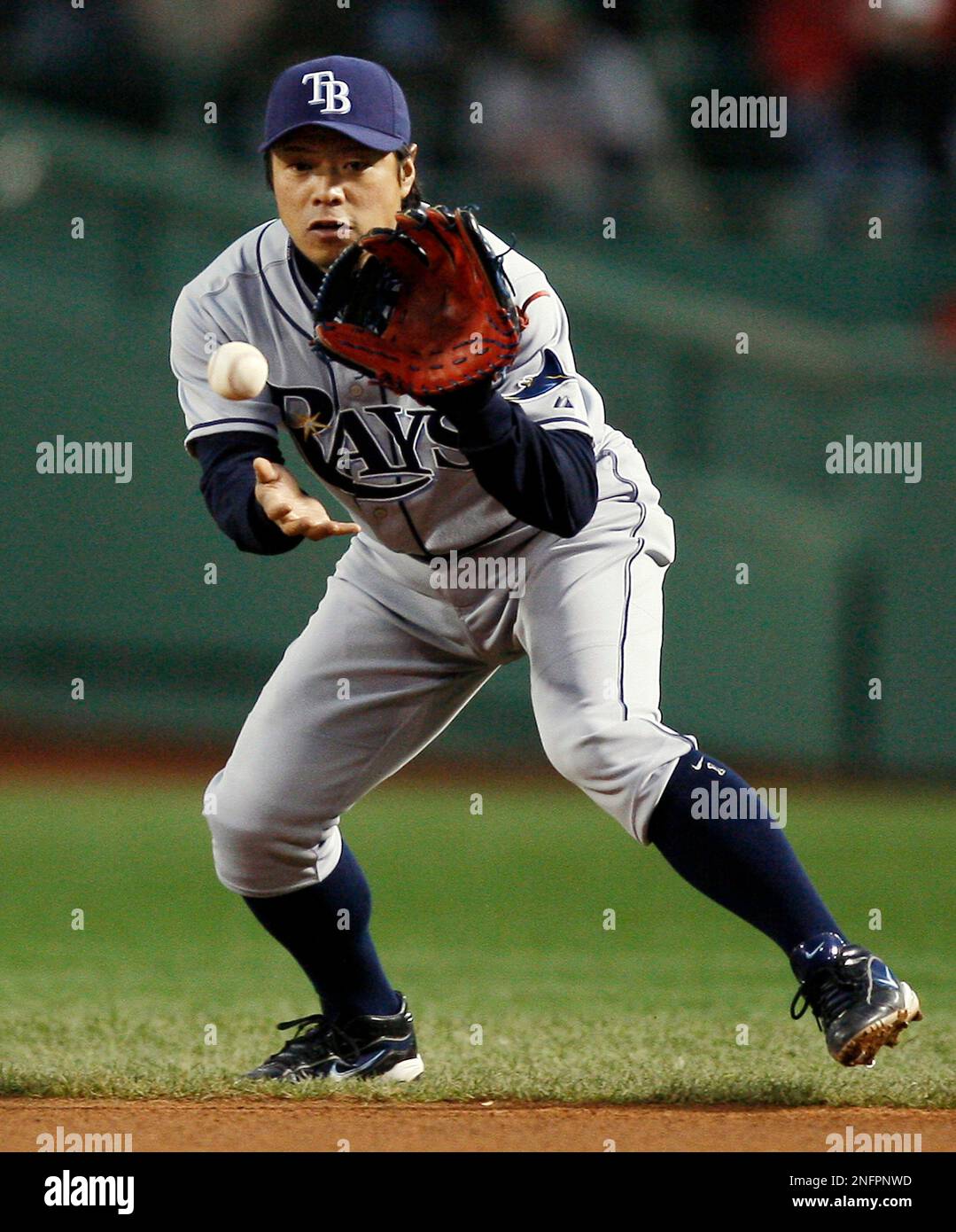 Tampa Bay Rays second baseman Akinori Iwamura of Japan fields a ground ...