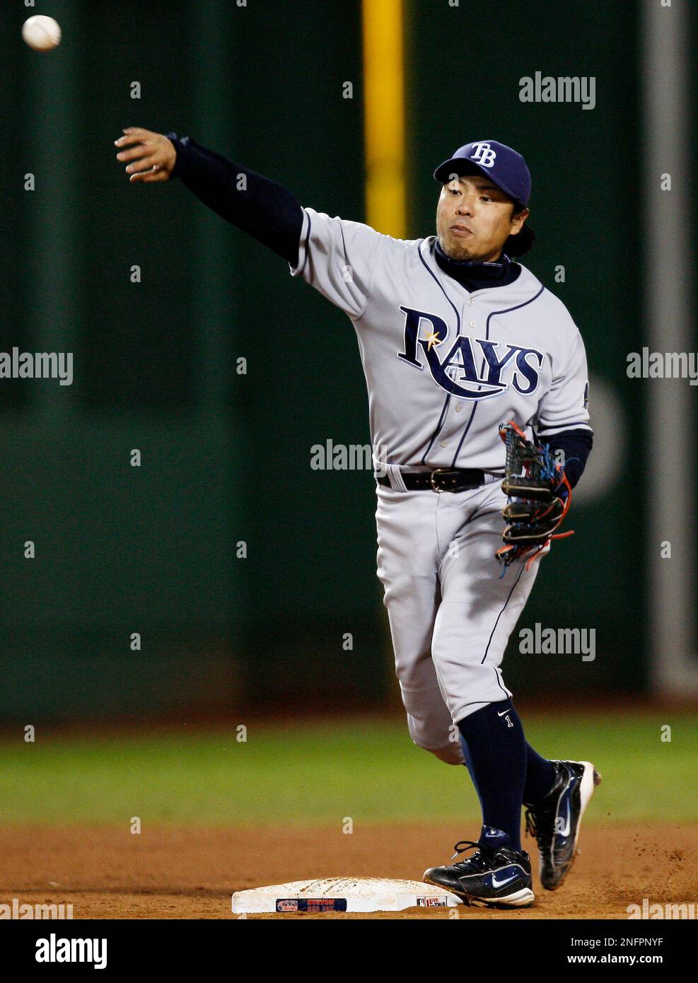 Tampa Bay Rays second baseman Akinori Iwamura of Japan throws to first ...