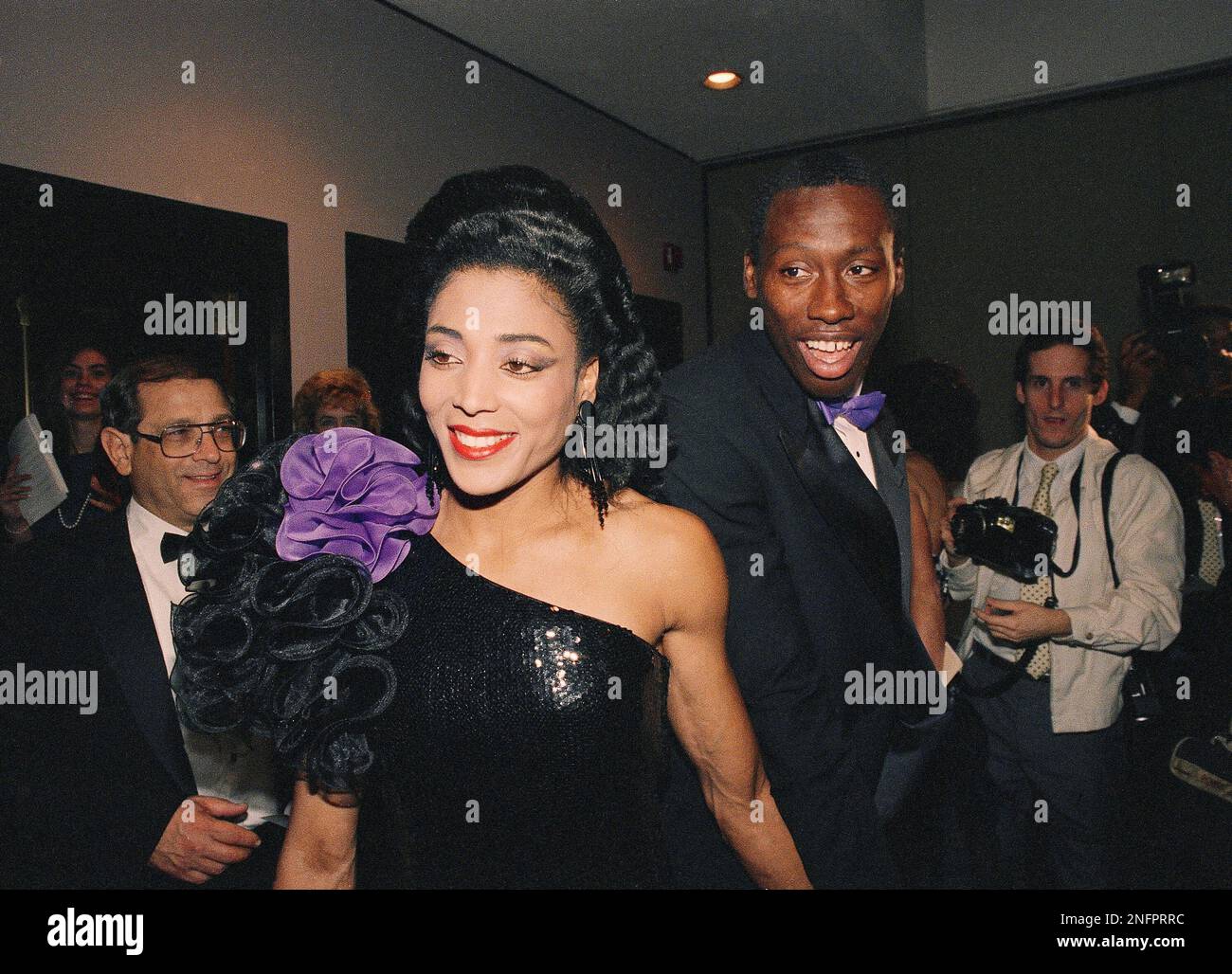 Florence Griffith Joyner, center, and her husband Al Joyner, right ...