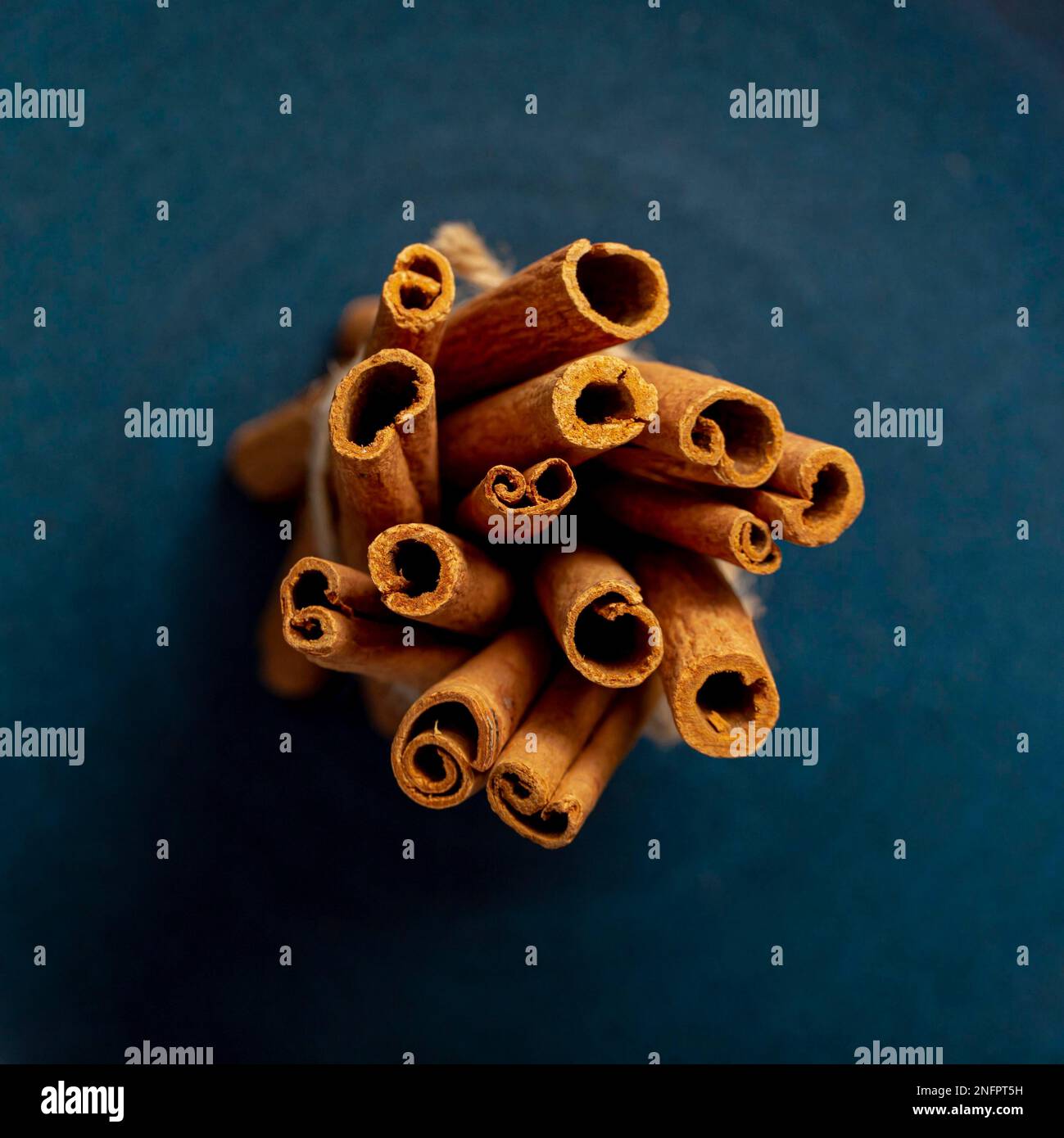 bunch cinnamon sticks dark blue background. High resolution photo Stock ...