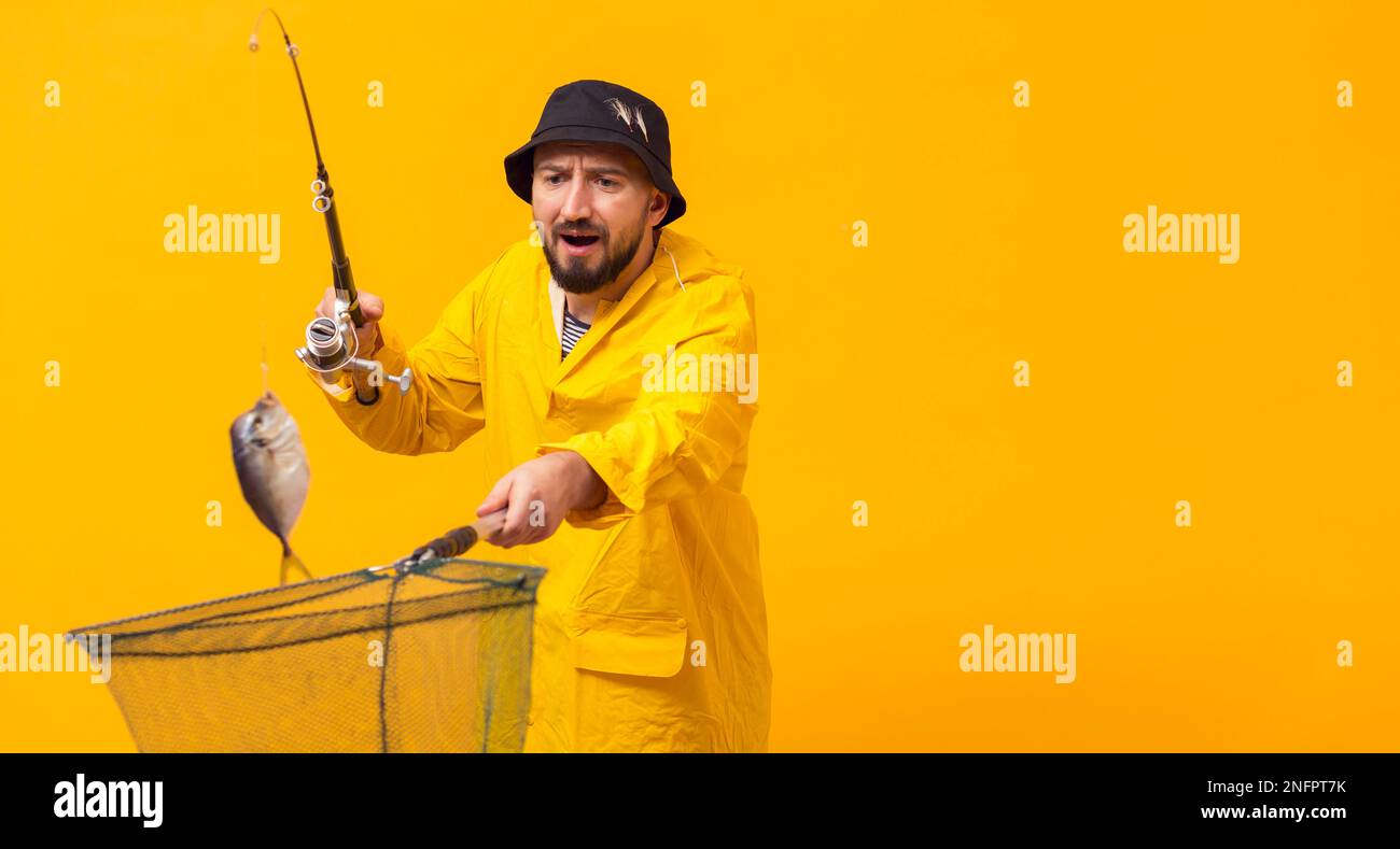 front view fisherman holding fishing rod net with copy space Stock ...