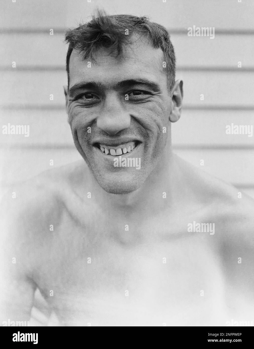 Boxer Primo Carnera, at 6 ft 6 inches, registered this big smile on ...