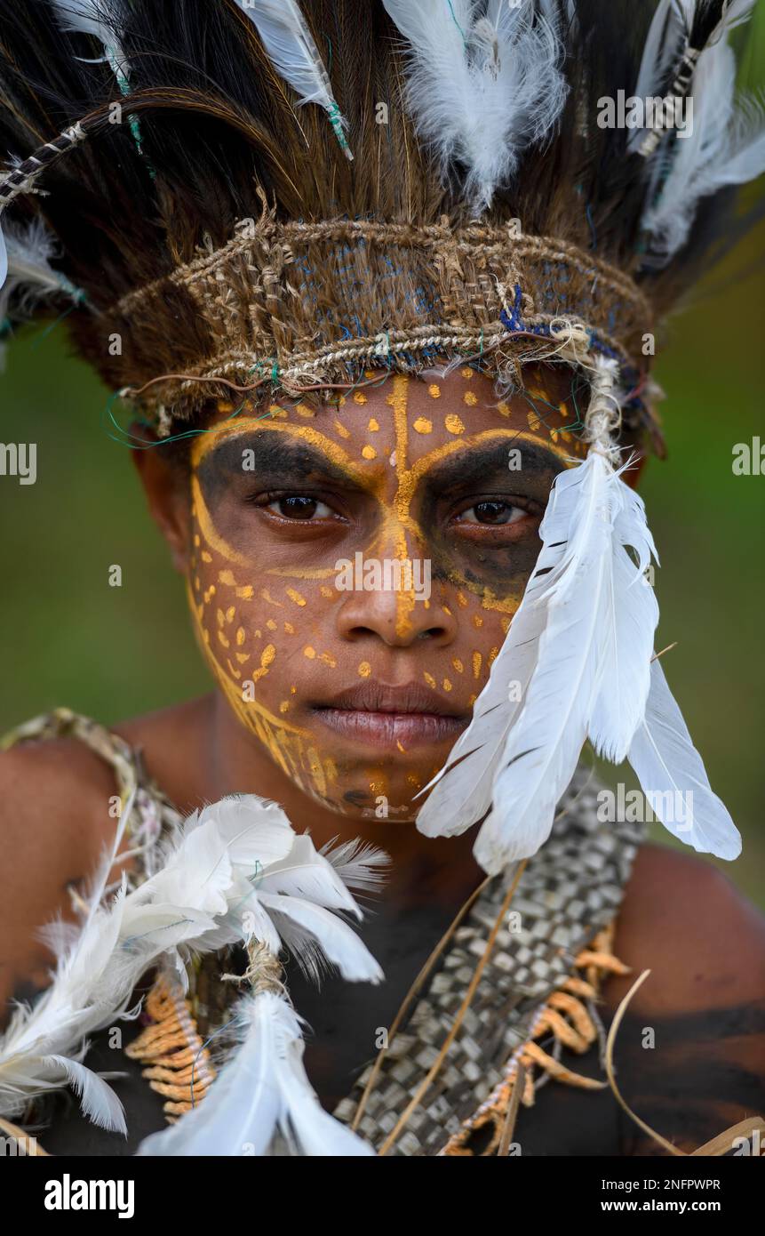 Portrait, young native woman, with face painting and feather headdress ...