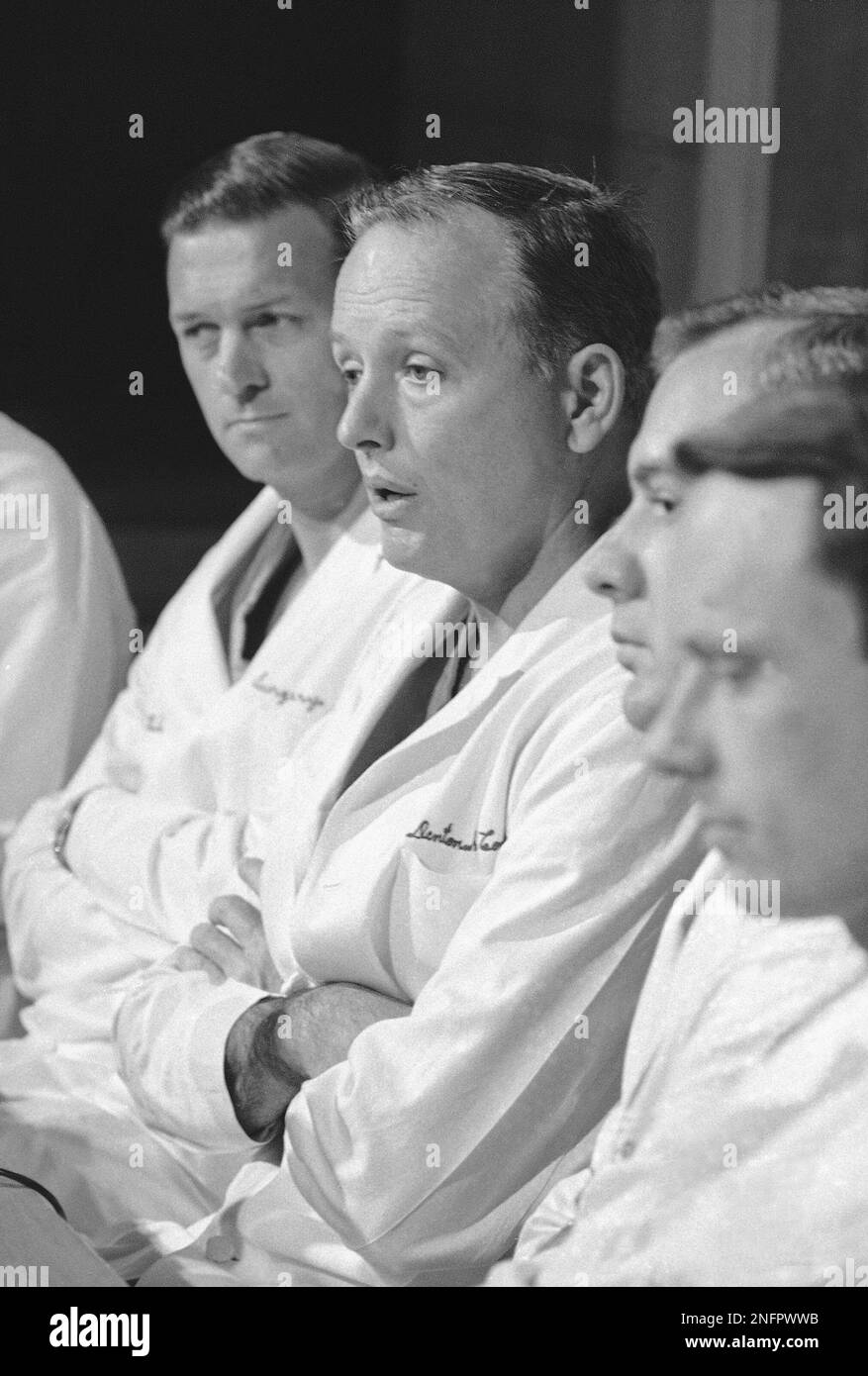 Dr. Denton A. Cooley with arms folded as he told newsmen on May 22 ...