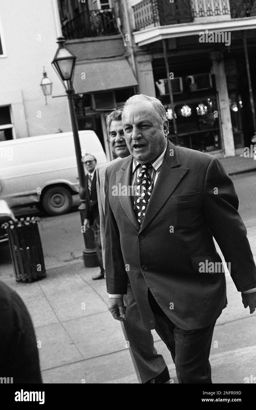 Reputed Mafia boss Carlos Marcello is flanked by attorney Mike Maroun ...