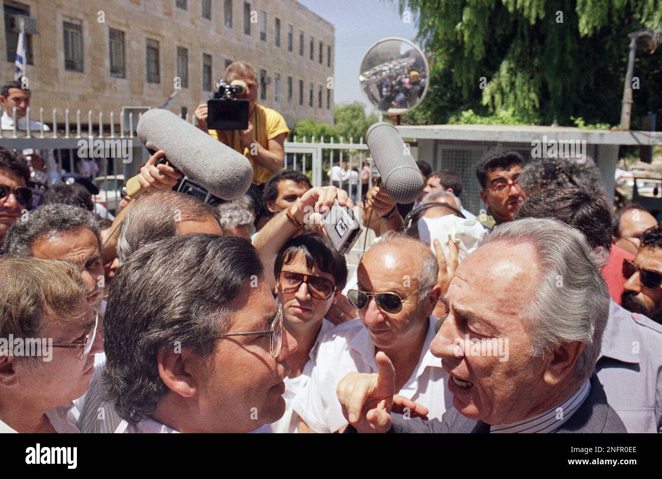 Minister of Finance Shimon Peres shakes his finger at Mazime Levy ...