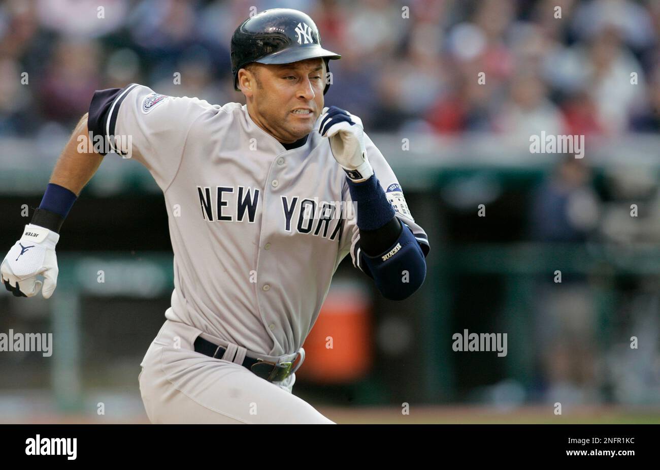New York Yankees' Derek Jeter runs out a ground ball for a single ...
