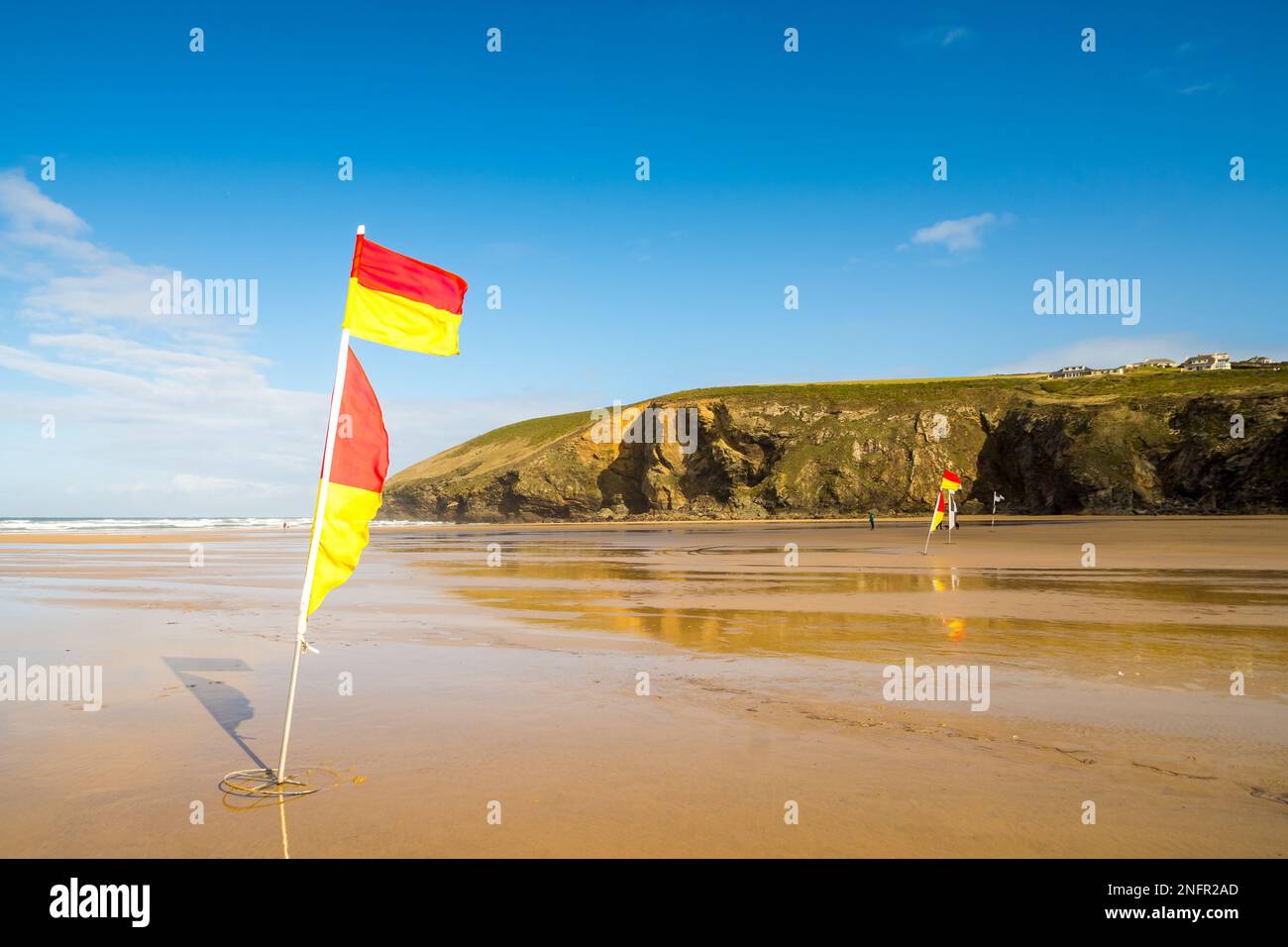 Lifeguard flags on the beach at Mawgan Porth near Newquay Cornwall ...