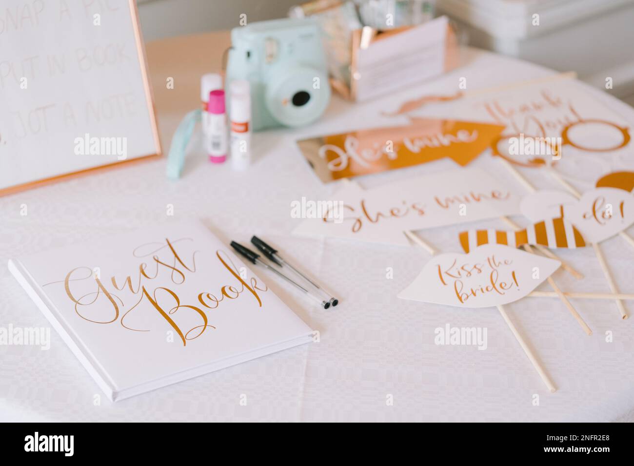 Guest book and props for Photo Booth Stock Photo - Alamy