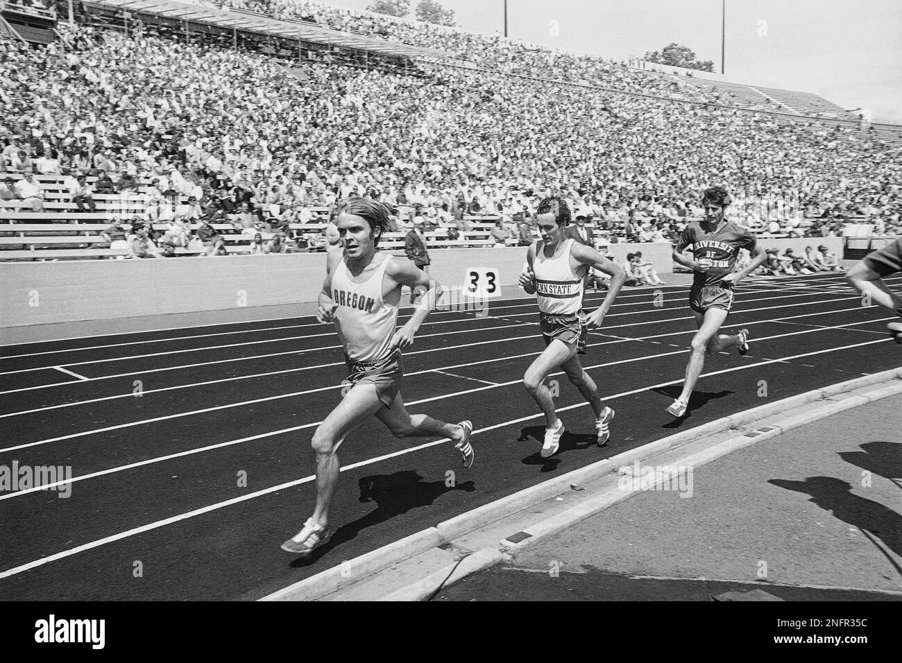 Oregon's Steve Prefontaine maintains a lead over Greg Fredericks of ...