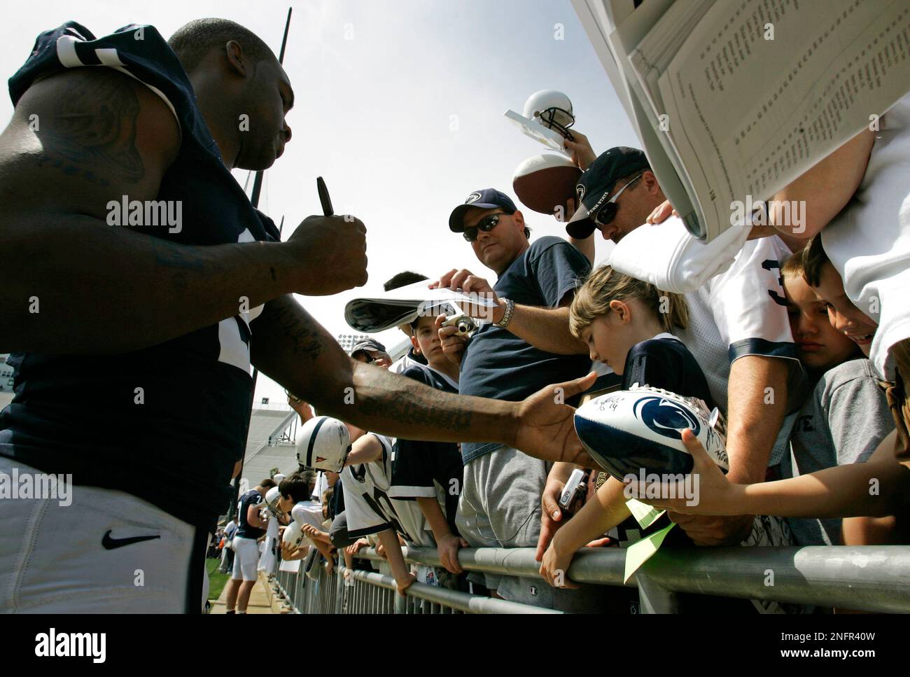 Penn State quarterback Daryll Clark signs autographs for fans before ...