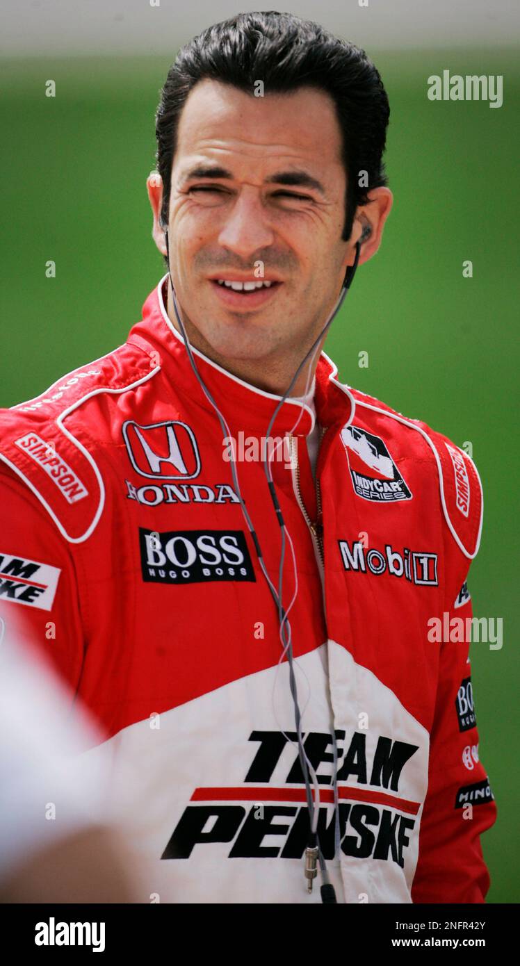 IRL driver Helio Castroneves wait to qualify for the Road Runner Turbo ...