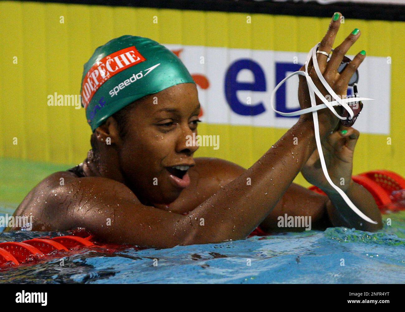 French swimmer Malia Metella reacts after winning the 50 meter ...