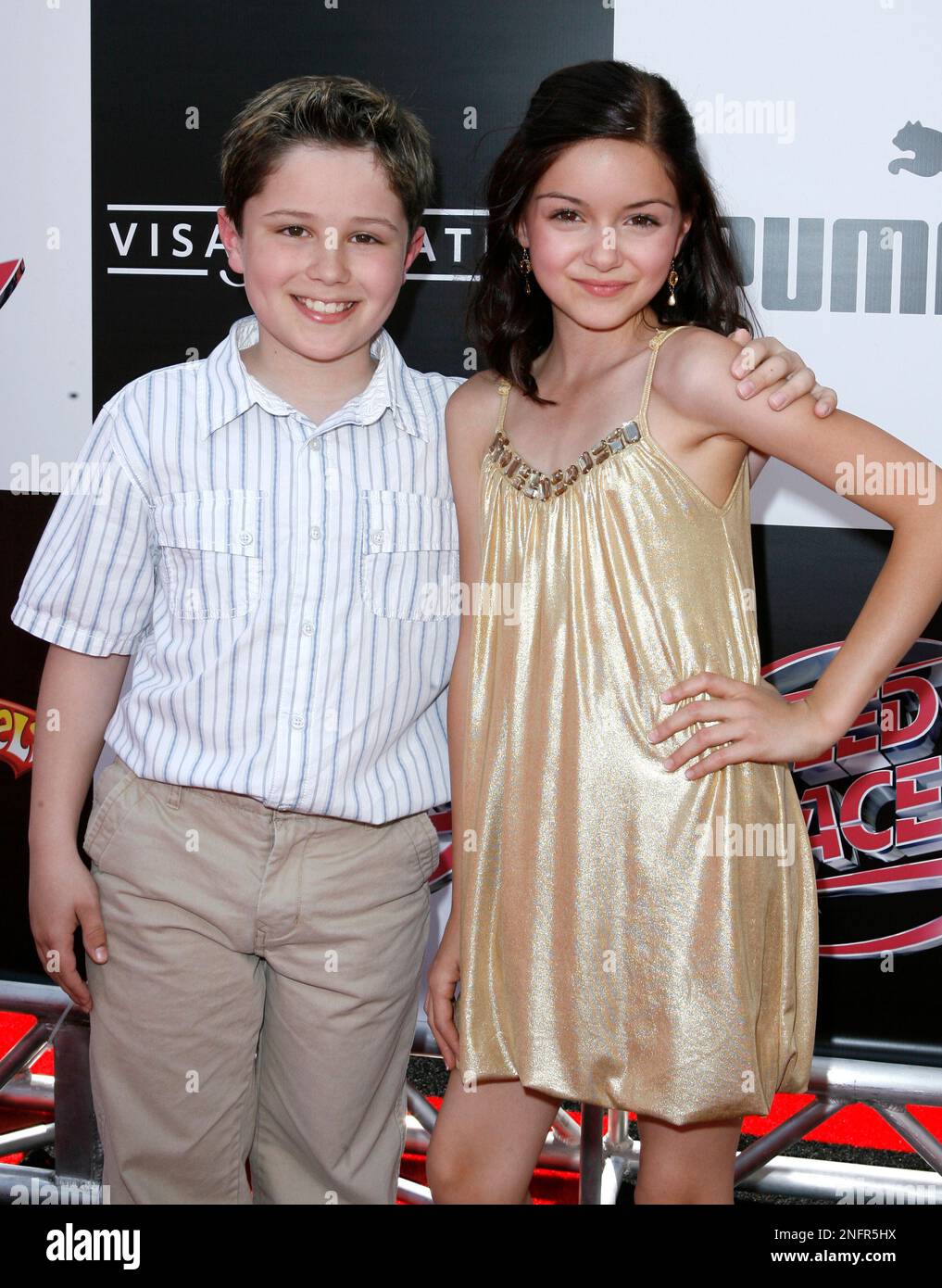 Actors Nicholas Elia, left and Ariel Winter arrive at the premiere of ...