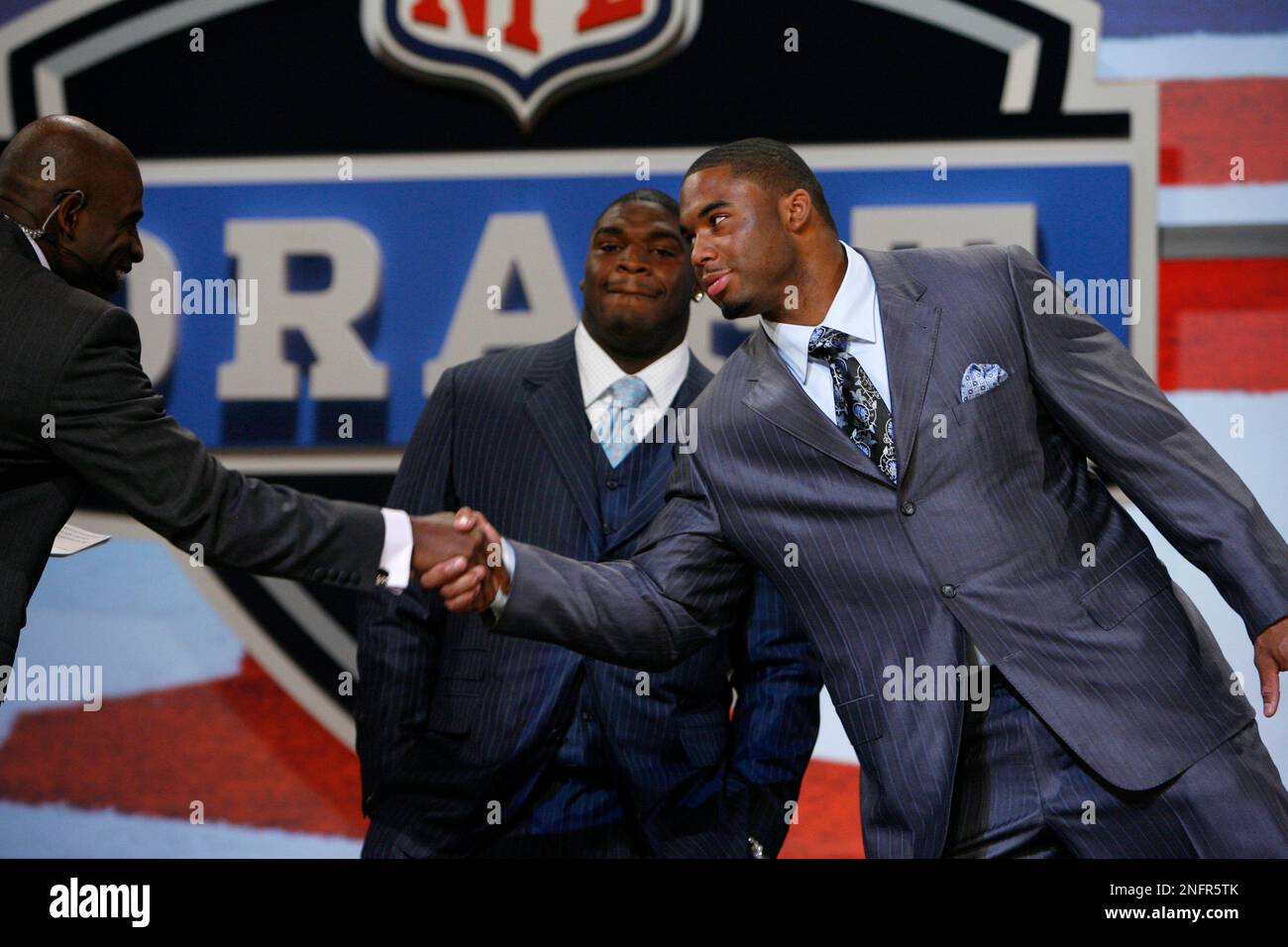 Vernon Gholston, right, the sixth overall pick by the New York Jets ...