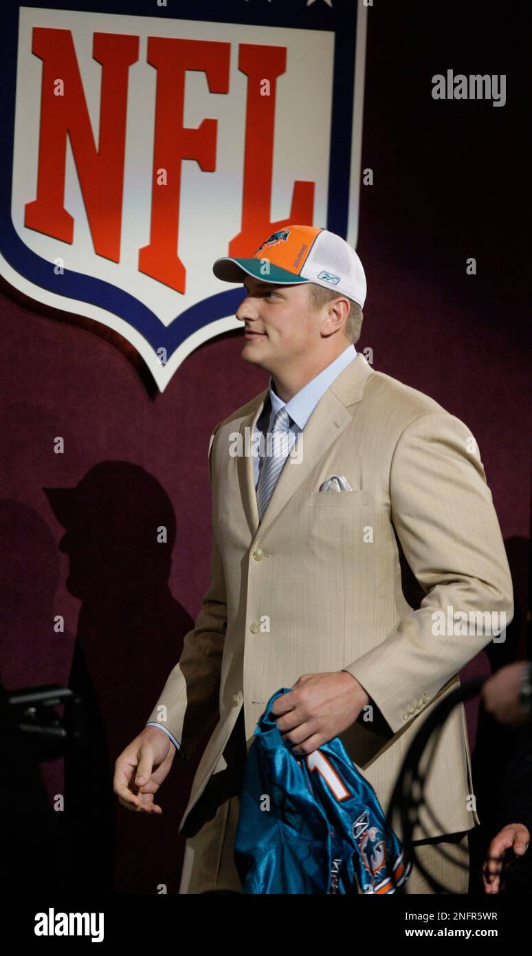 Jake Long holds a Miami Dolphins jersey after being announced as the ...