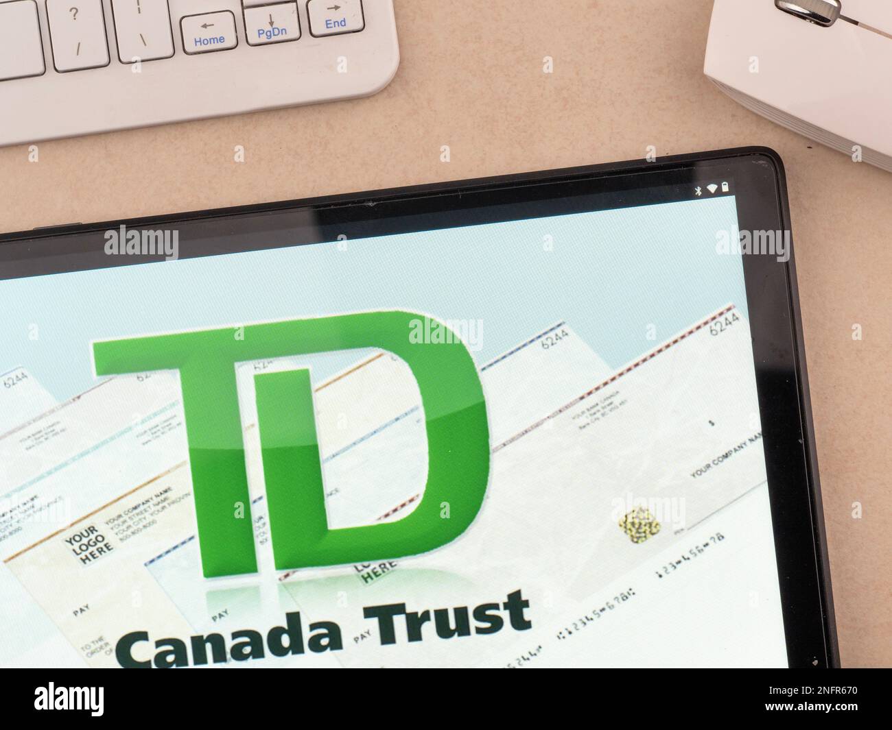 In this photo illustration, TD Canada Trust logo seen displayed on a ...