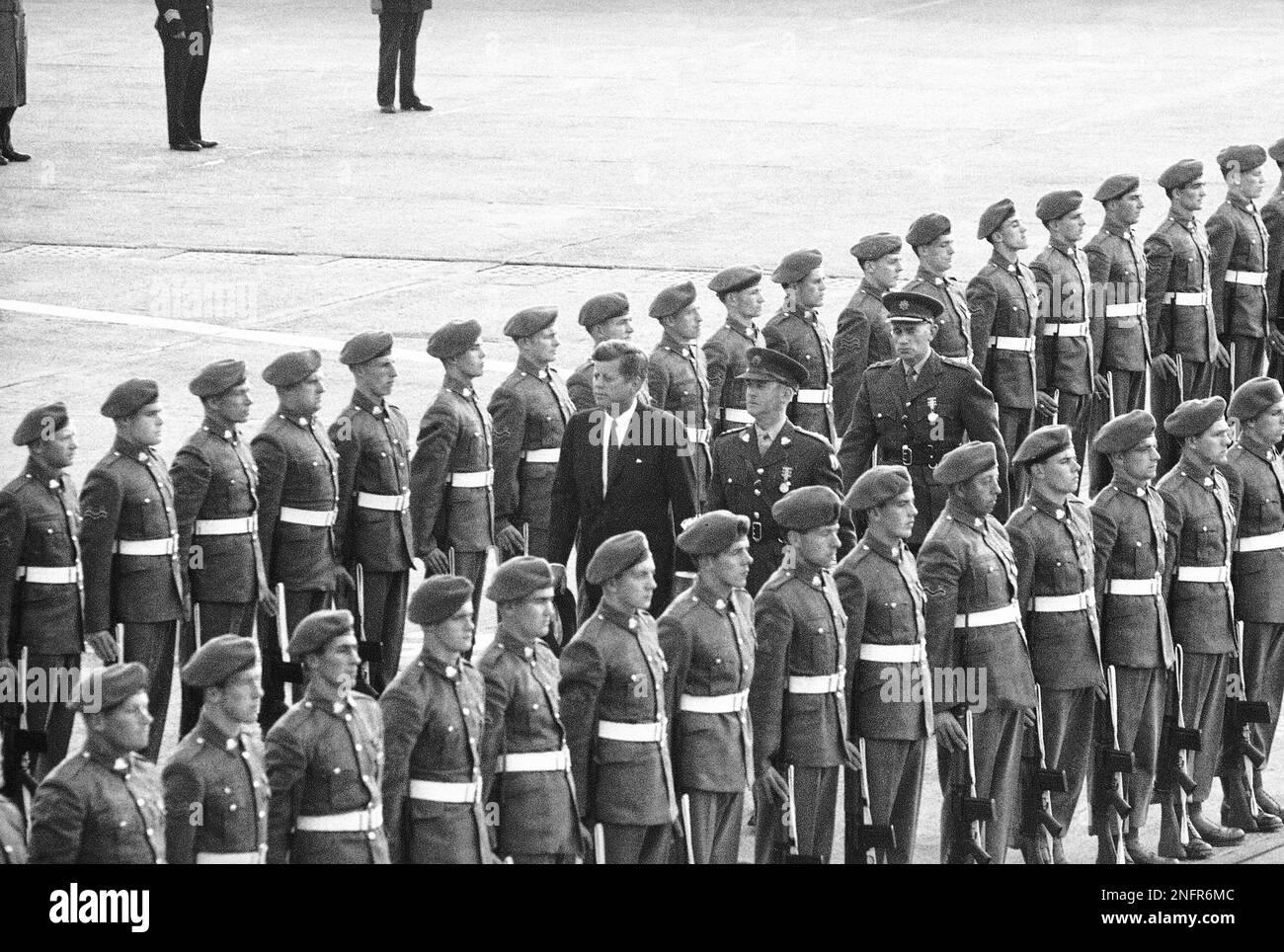 President John Kennedy passes between the ranks of the Honor Guard of ...