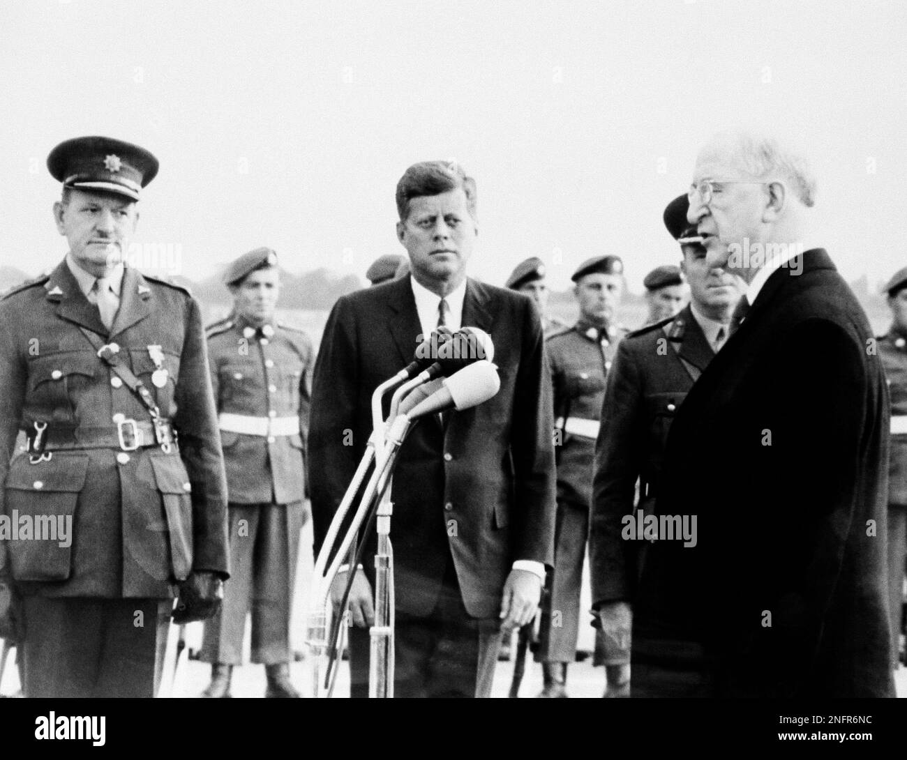 President John Kennedy, center, stands at Dublin Airport, June 26, 1963 ...