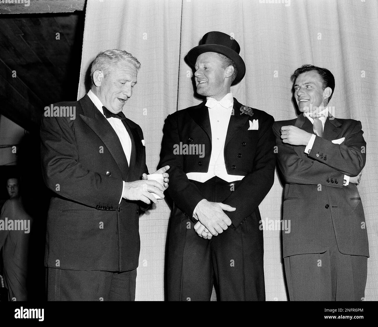Actors Spencer Tracy, Van Johnson and Frank Sinatra gather backstage at ...
