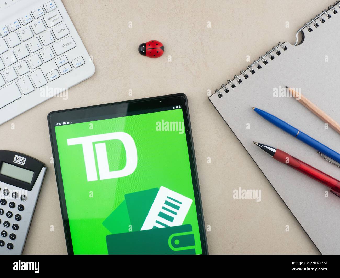 In this photo illustration, TD Canada Trust logo seen displayed on a ...