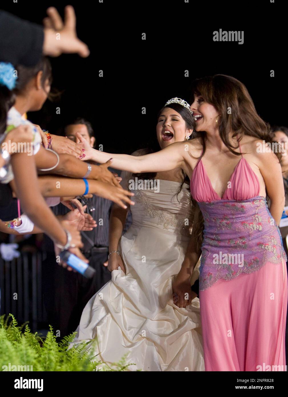 Nathalie Ortega, center, and singer Karyme Lonazo, right greet cheering ...