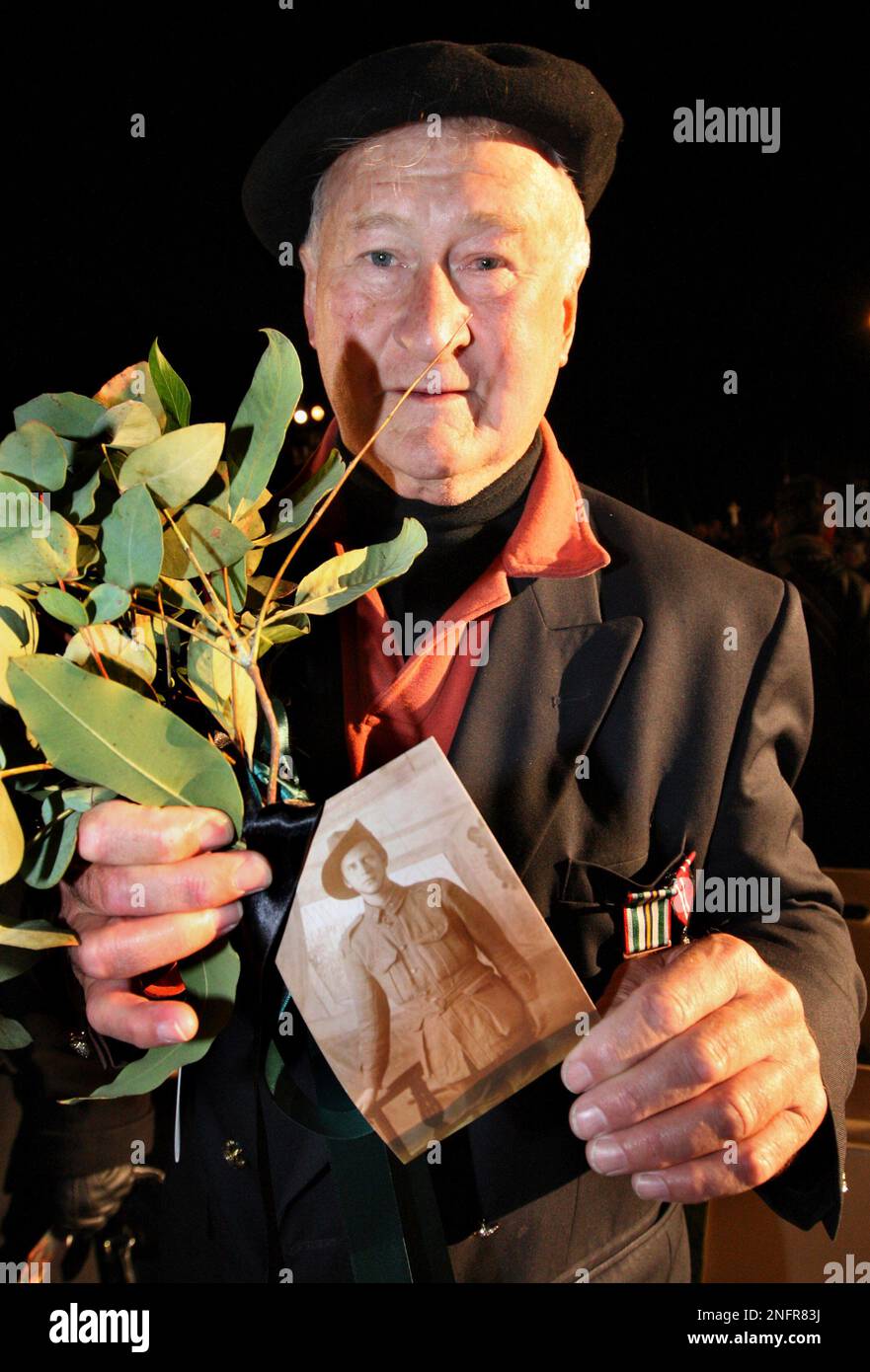 Australia's Robin Mc Gee holds a pictures of his grandfather during ...