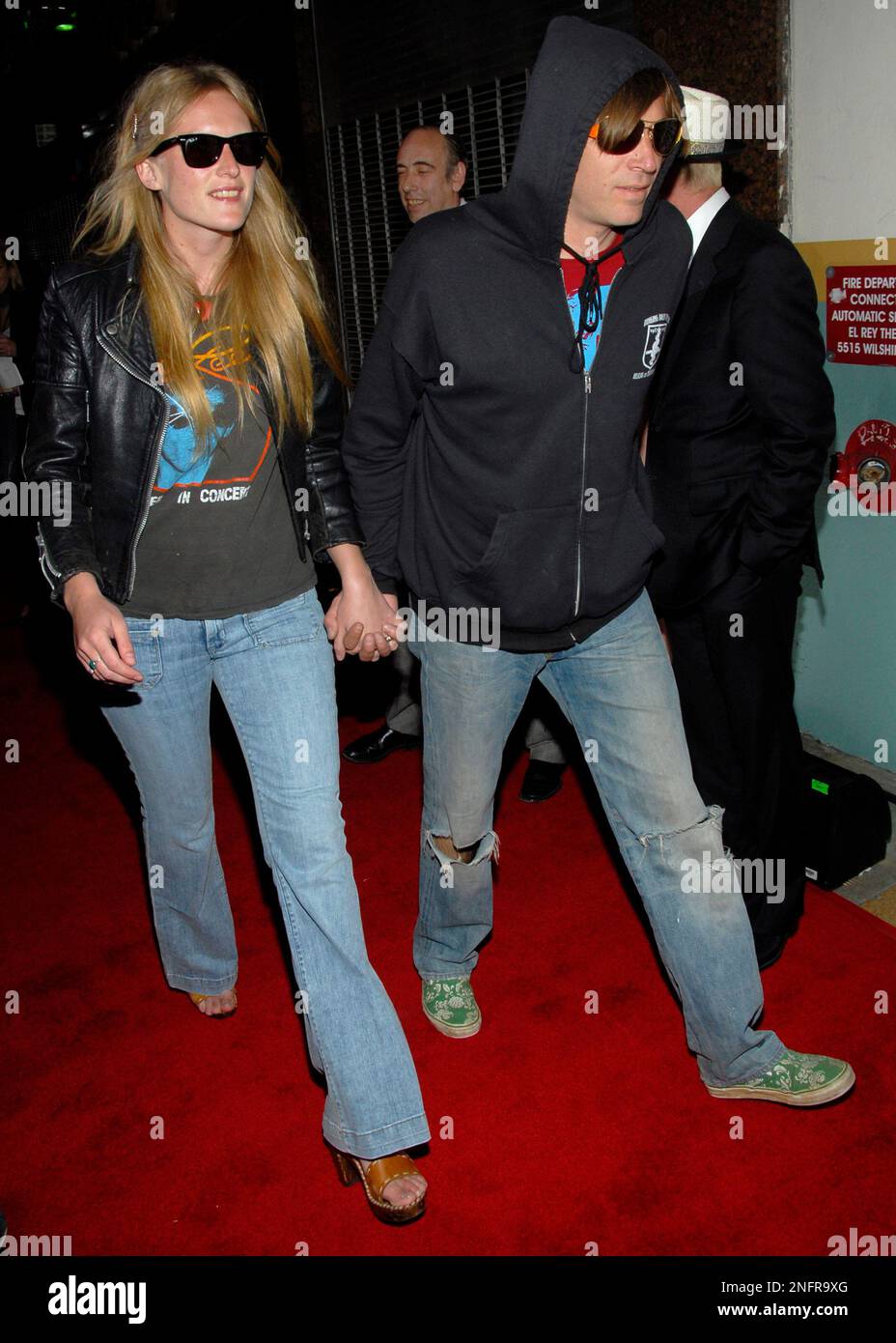 Singer Evan Dando, right, and model Elizabeth Moses walk the press line ...