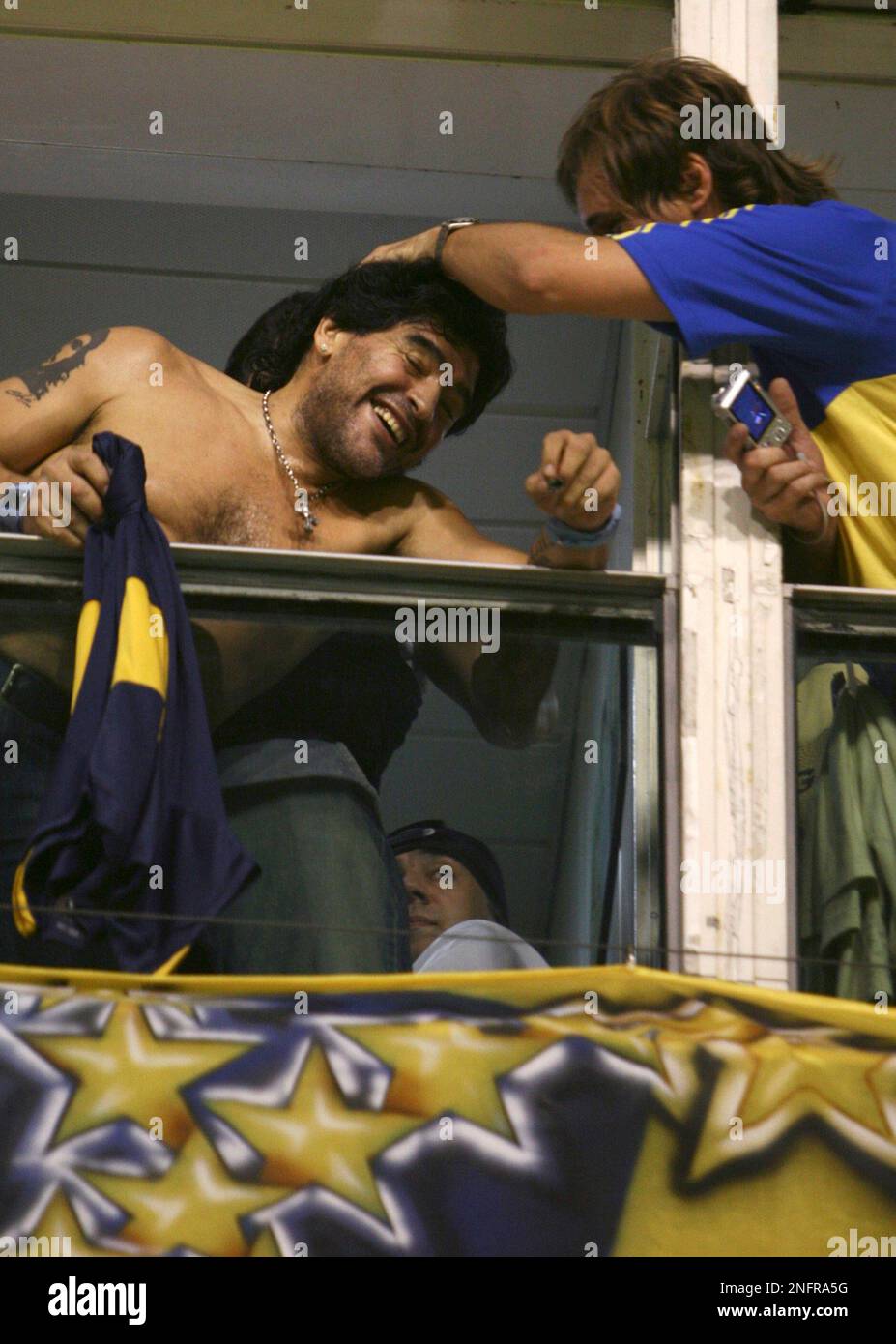 Soccer star Argentina's Diego Armando Maradona, left, is greeted by a ...