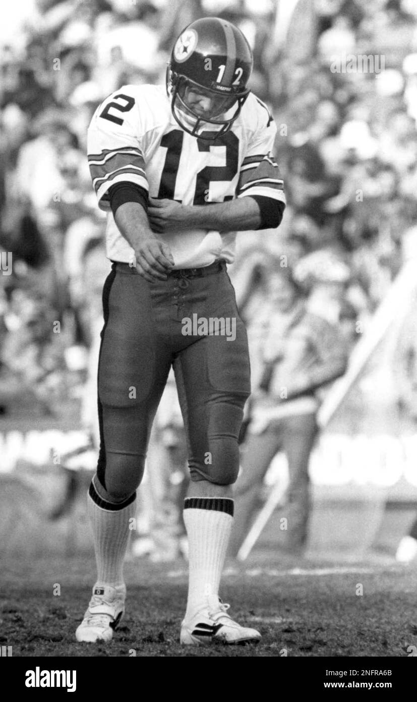 Pittsburgh Steelers quarterback Terry Bradshaw walks off the field in ...