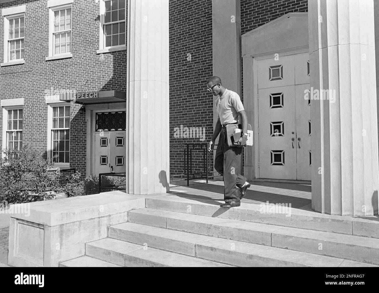 African American James Hood leaves a door of the Music and Speech ...