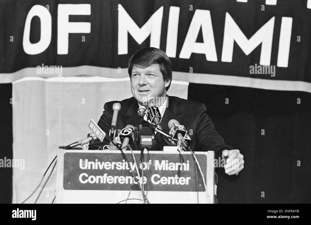 Jimmy Johnson smiles while answering a question at a news conference ...