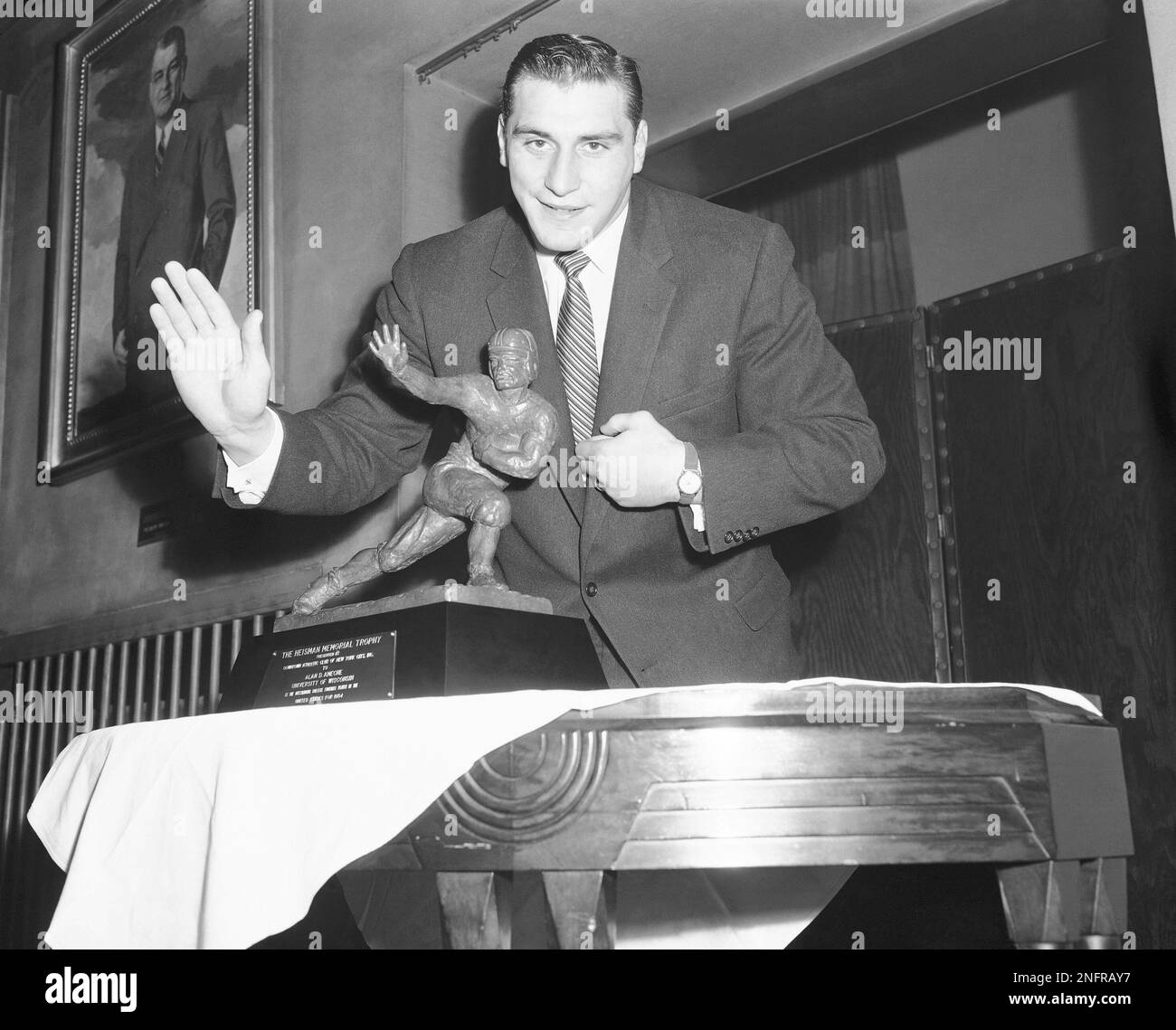 Alan Ameche is shown with his Heisman Trophy at New York's Downtown ...