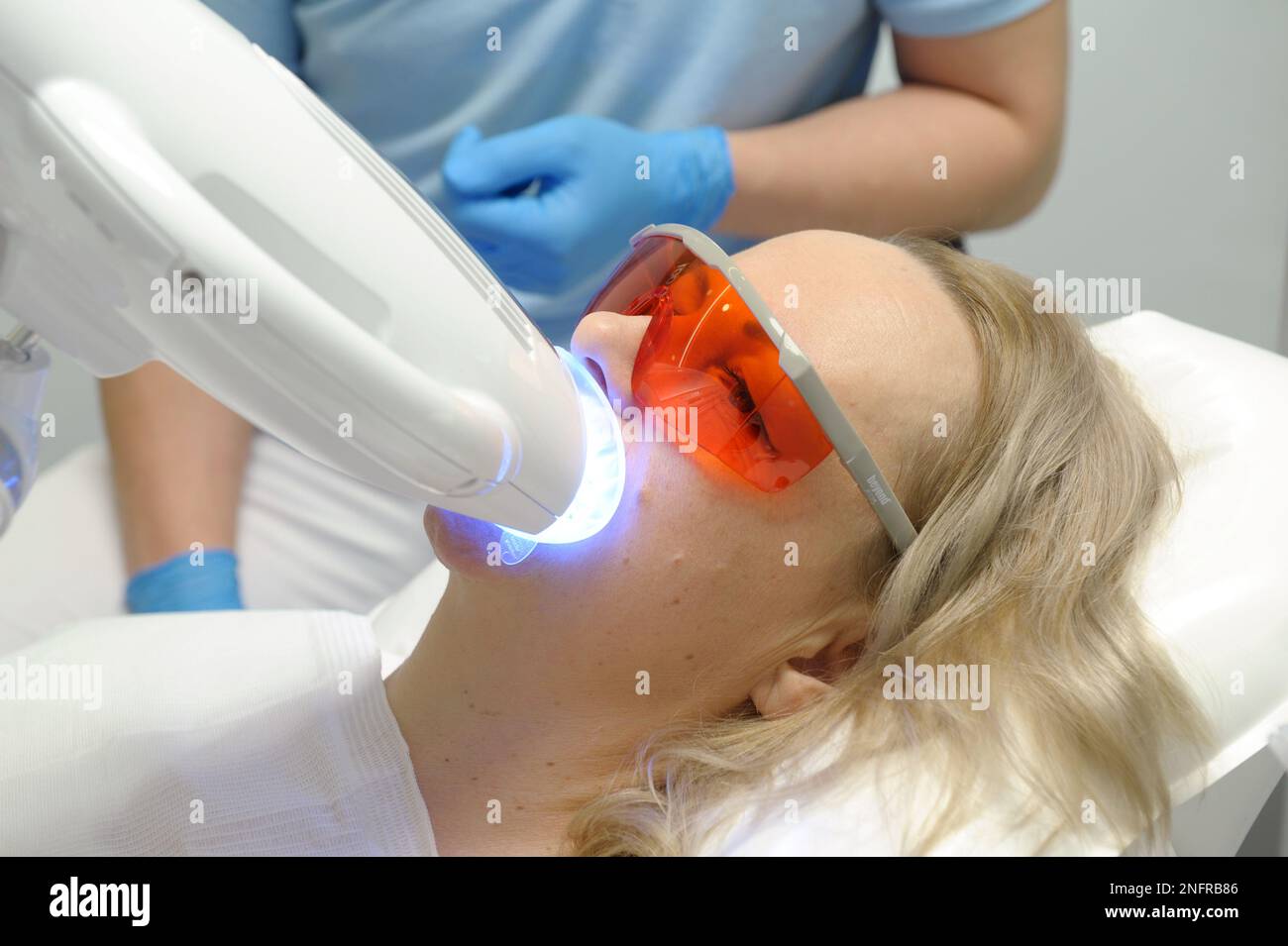 close-up of a woman's face under apparatus Beyond Poluse Plus Advanced ...