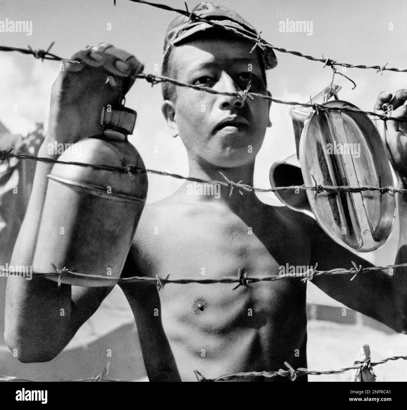 In this photo provided by the U.S. Navy, a Japanese soldier POW looks ...